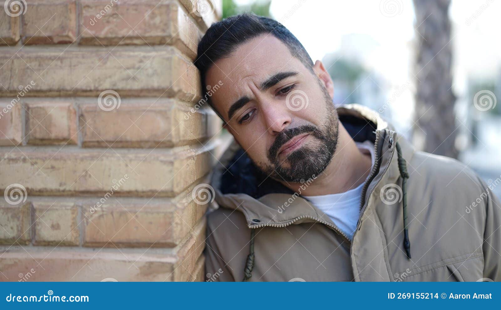 Young Hispanic Man Standing with Sad Expression at Street Stock Photo ...