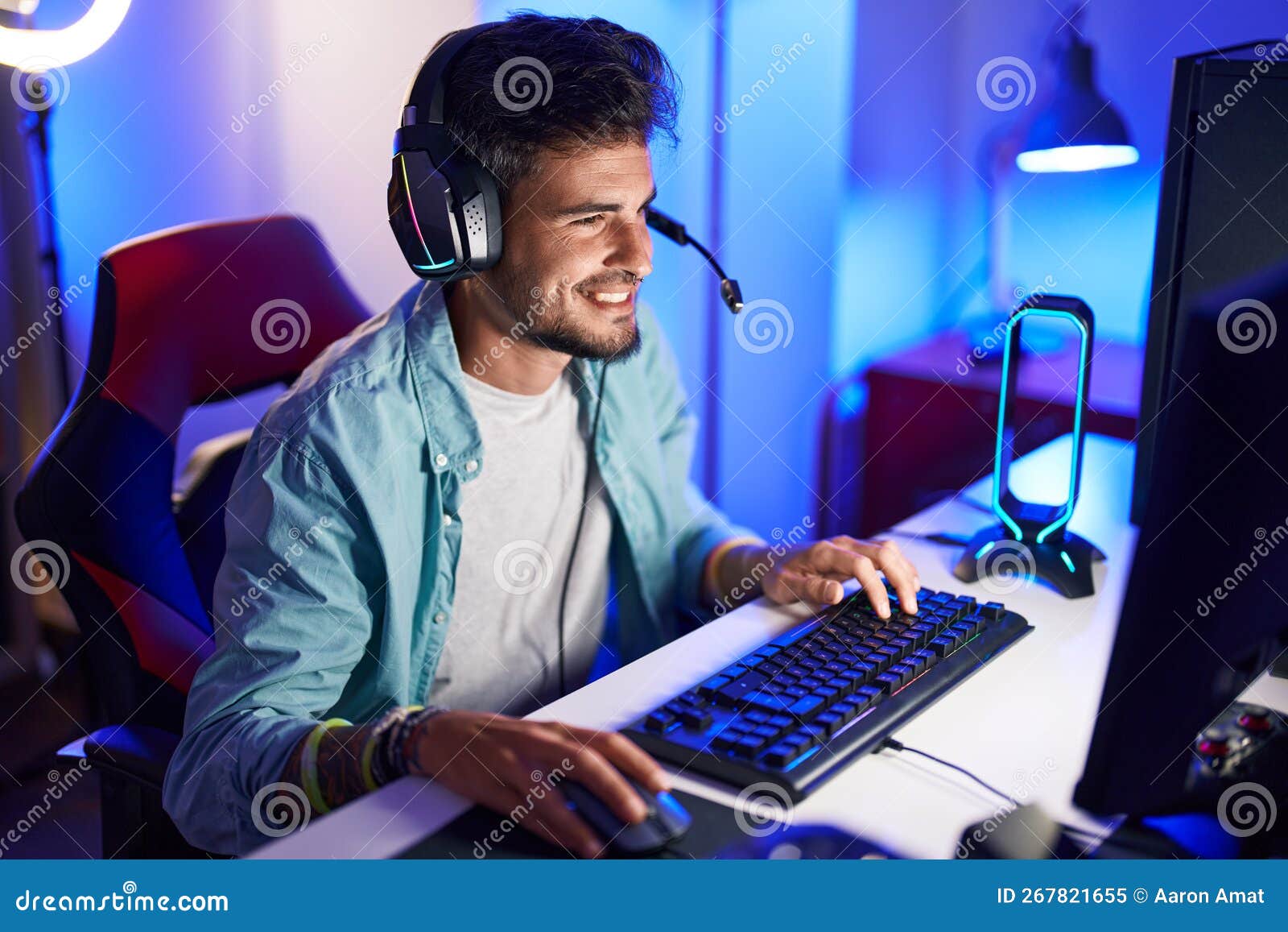 Young Hispanic Man Streamer Playing Video Game Using Computer at Gaming ...