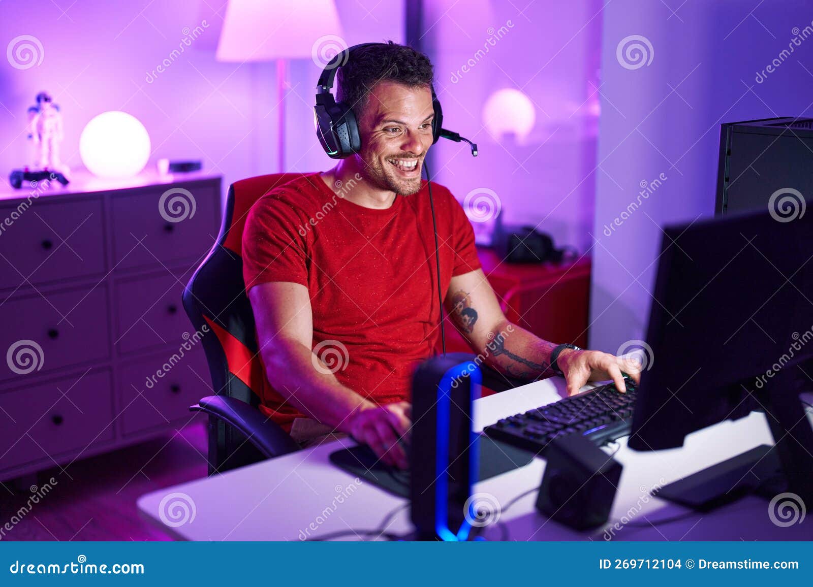 Young Hispanic Man Streamer Playing Video Game Using Computer at Gaming ...