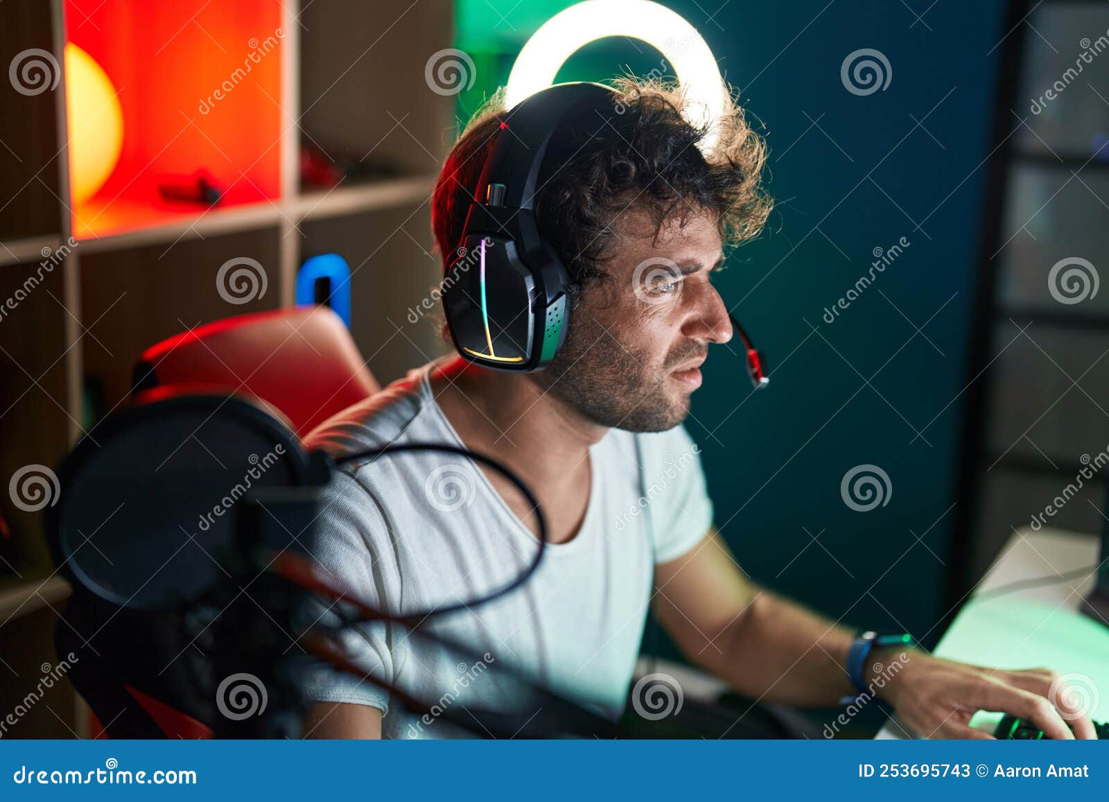 Young Hispanic Man Streamer Playing Video Game Using Computer at Music ...
