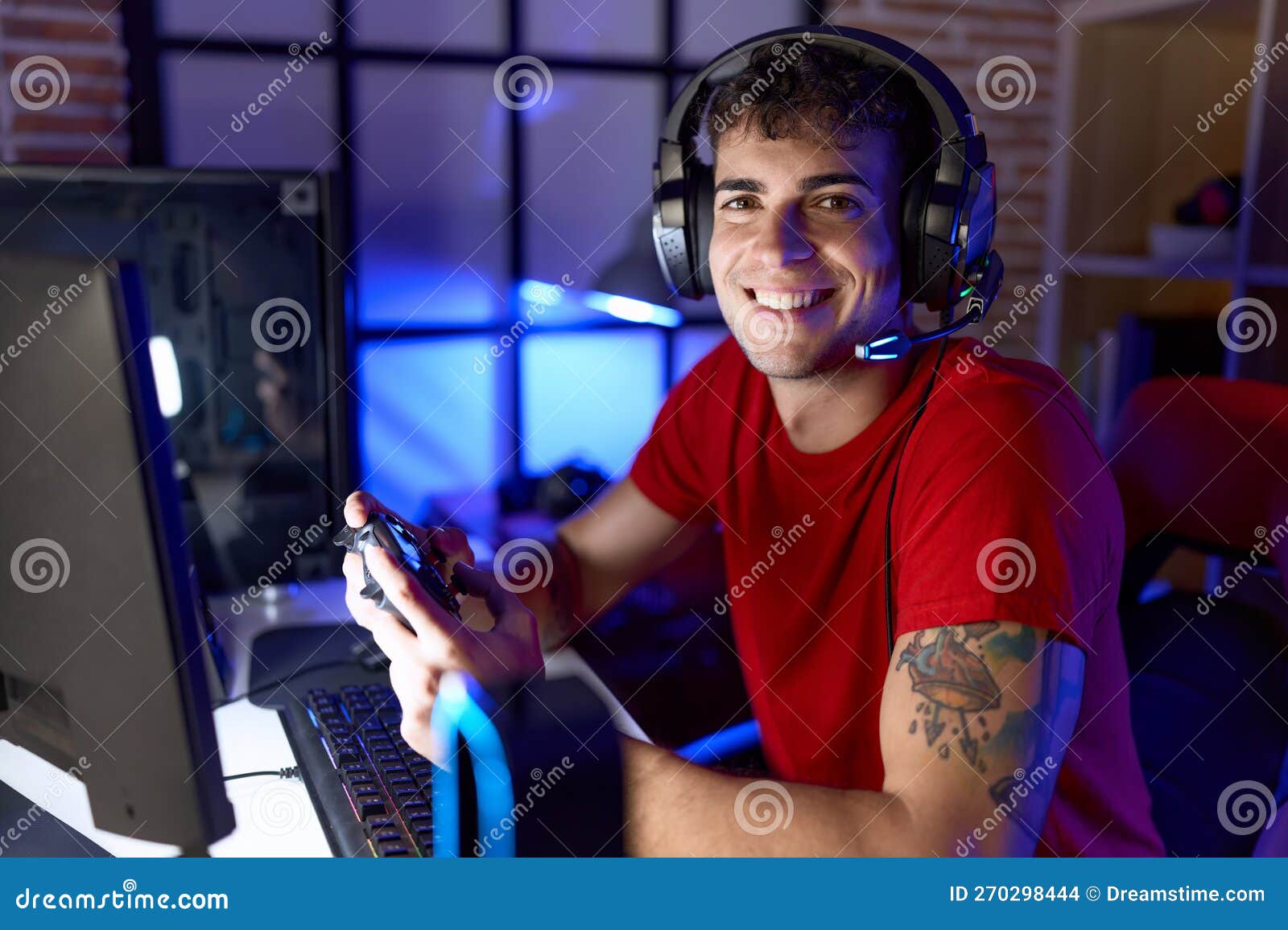 Young Hispanic Man Streamer Playing Video Game Using Joystick at Gaming ...