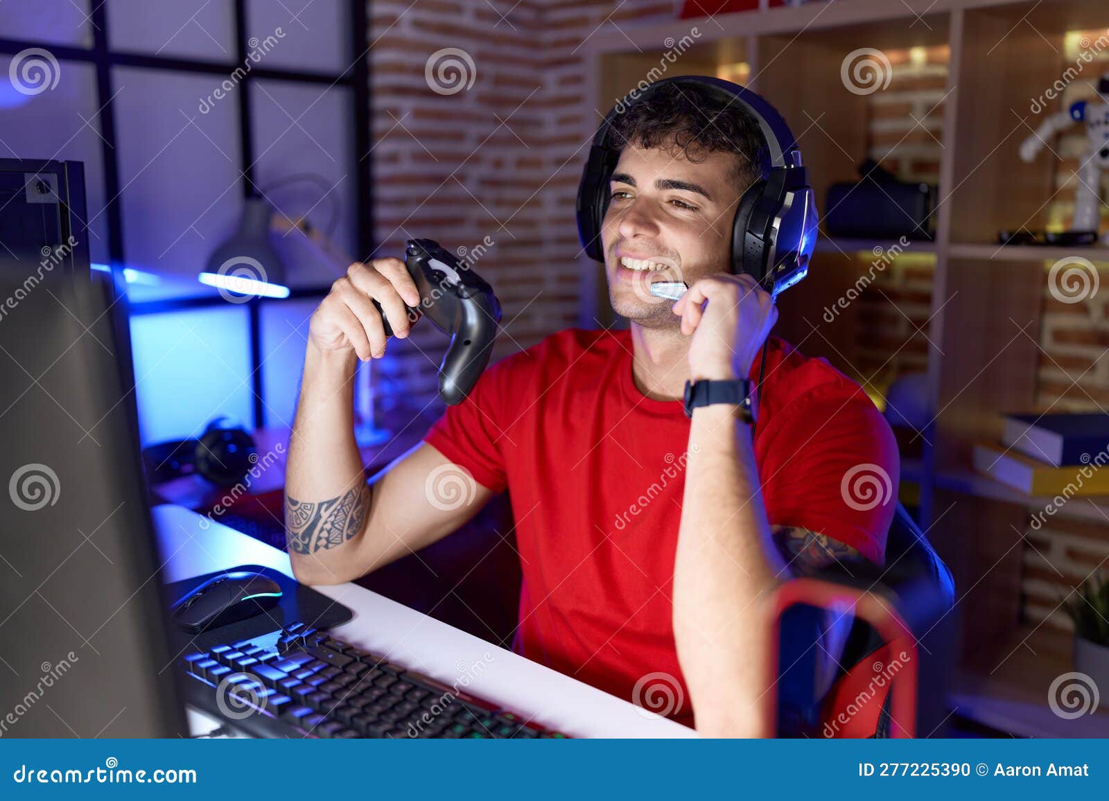 Young Hispanic Man Streamer Playing Video Game Using Joystick at Gaming ...