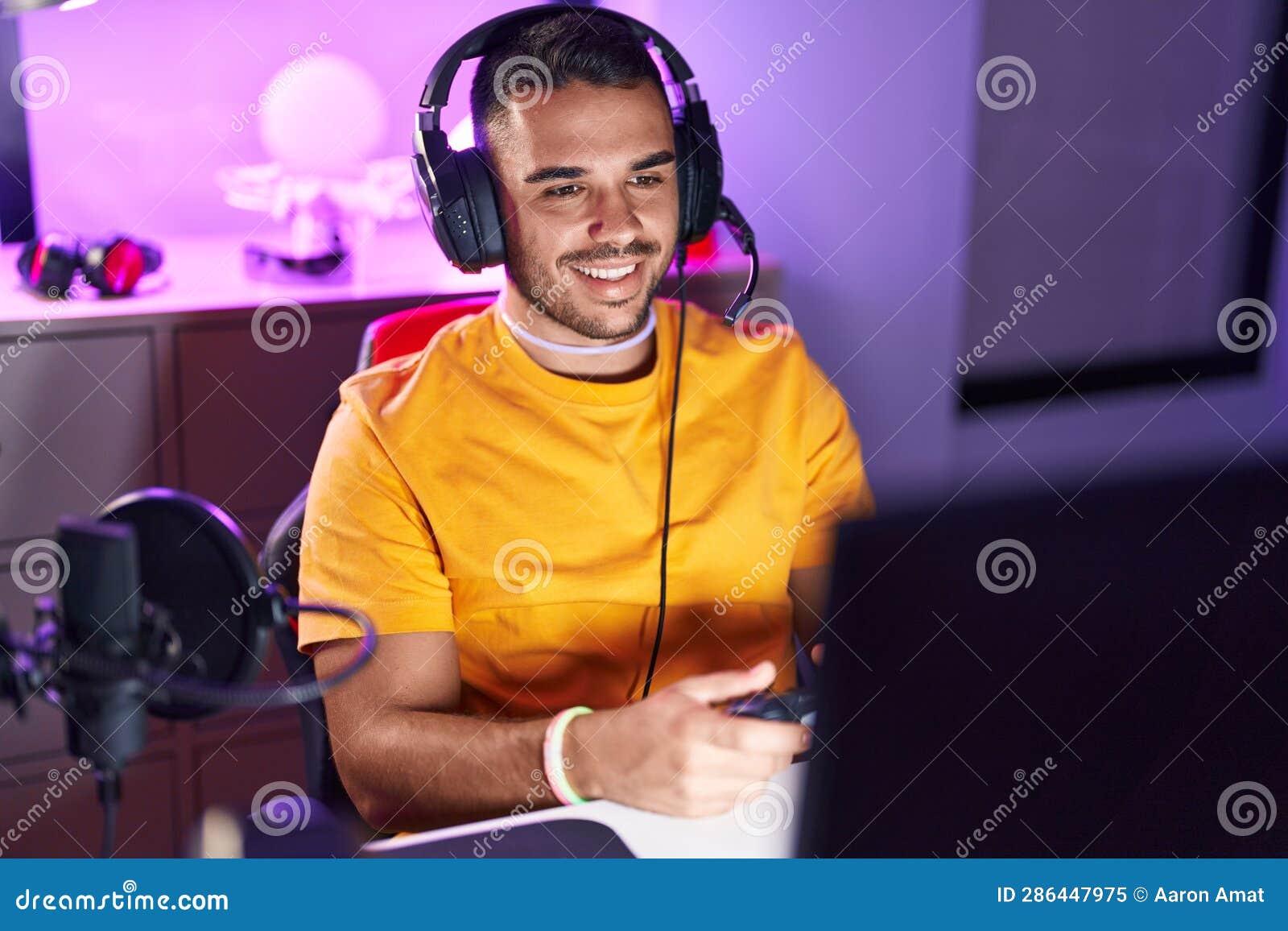 Young Hispanic Man Streamer Playing Video Game Using Joystick at Gaming ...