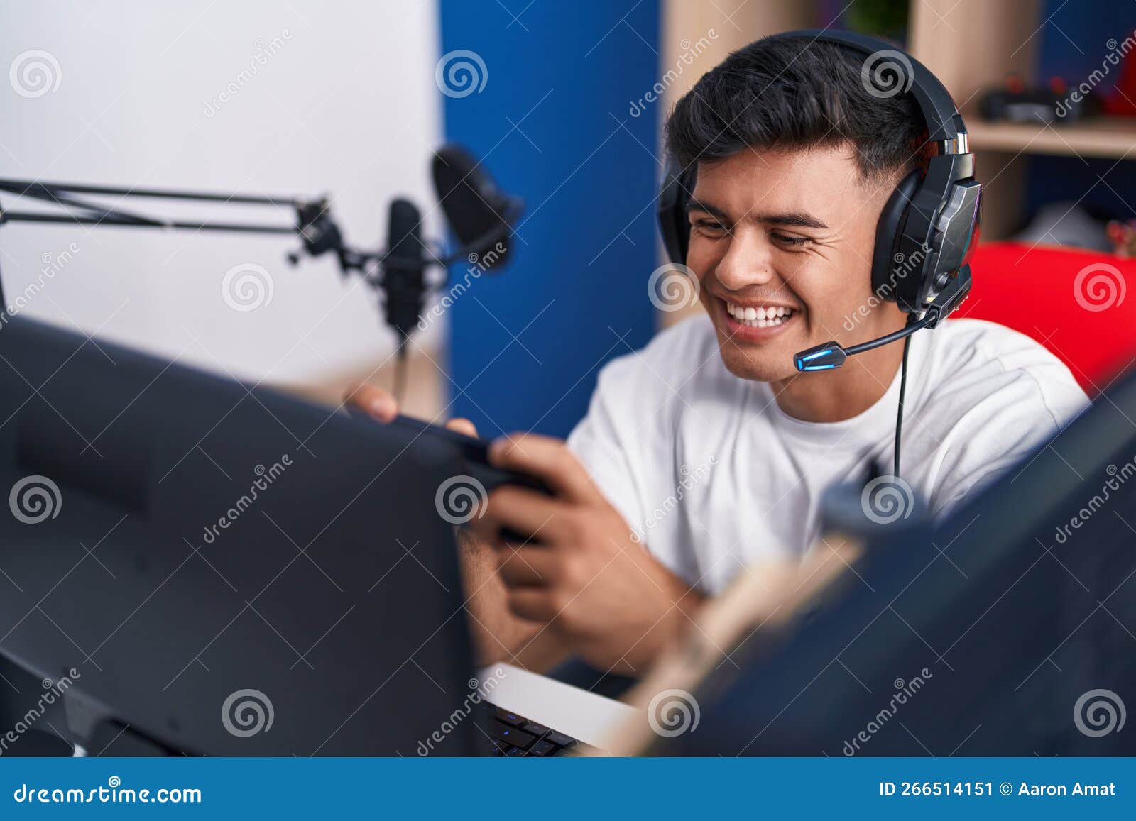 Young Hispanic Man Streamer Playing Video Game Using Smartphone at ...
