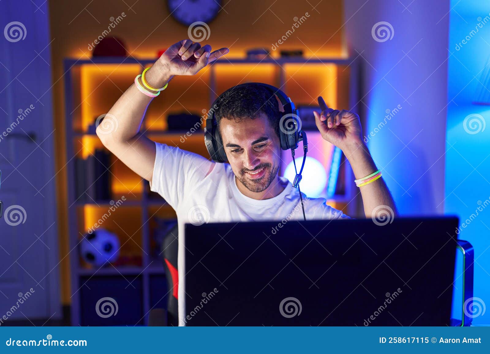 Young Hispanic Man Streamer Playing Video Game with Winner Expression ...
