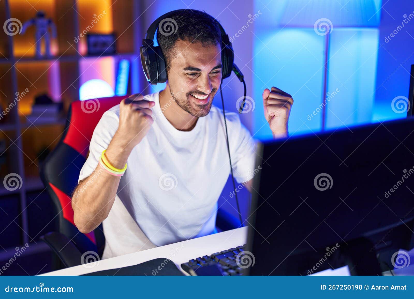 Young Hispanic Man Streamer Playing Video Game with Winner Expression ...