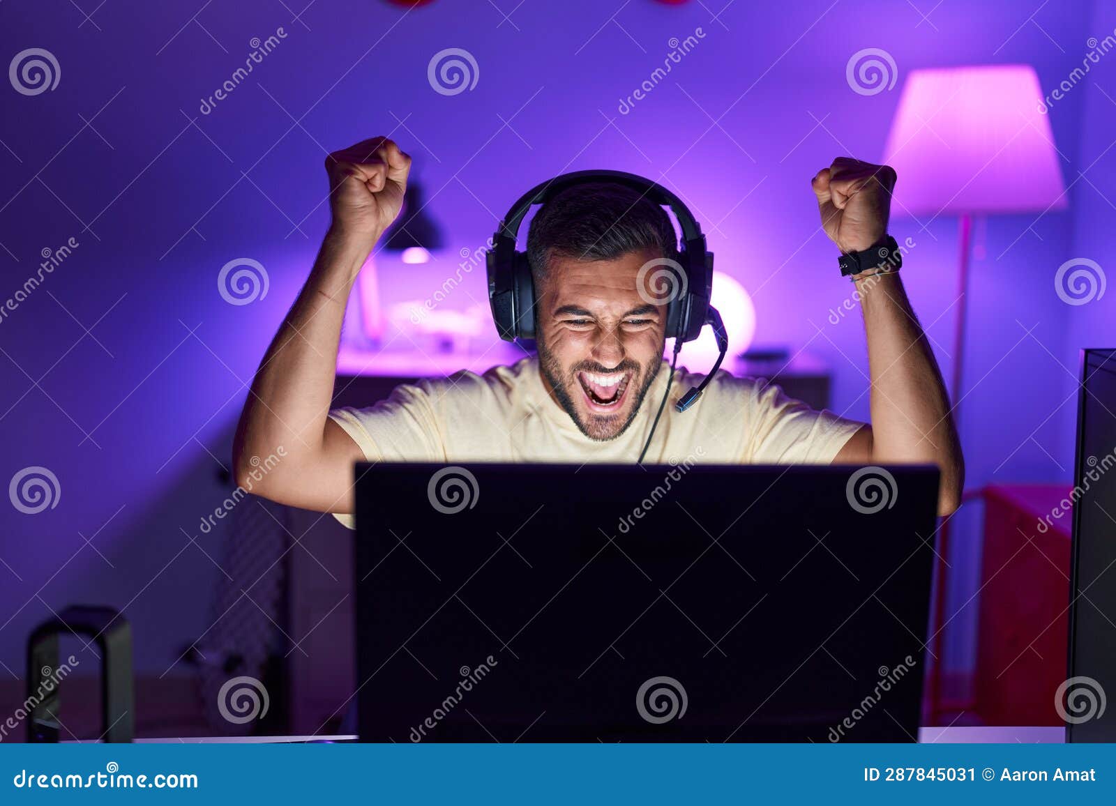 Young Hispanic Man Streamer Playing Video Game with Winner Expression ...