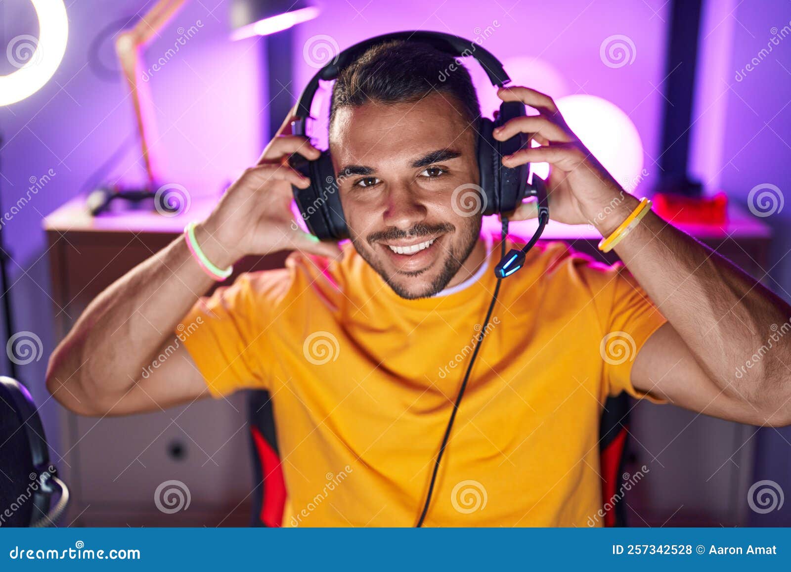 Young Hispanic Man Streamer Smiling Confident Sitting on Table at ...