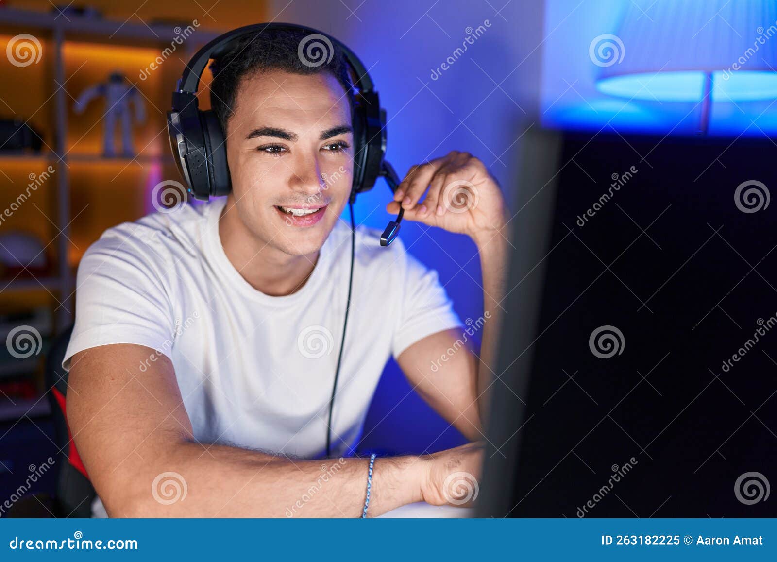 Young Hispanic Man Streamer Smiling Confident Sitting on Table at ...