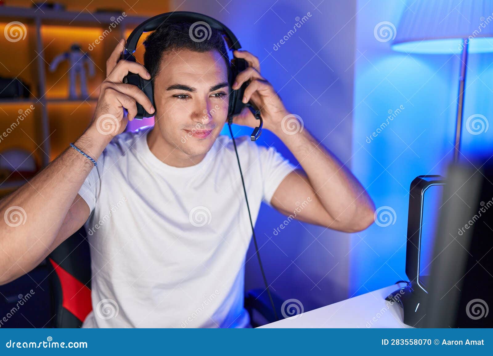 Young Hispanic Man Streamer Smiling Confident Sitting on Table at ...