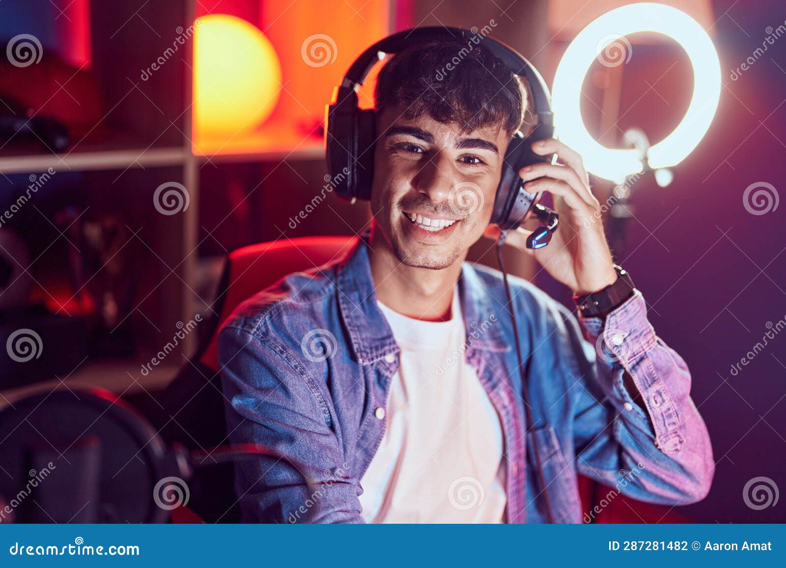 Young Hispanic Man Streamer Smiling Confident Sitting on Table at ...