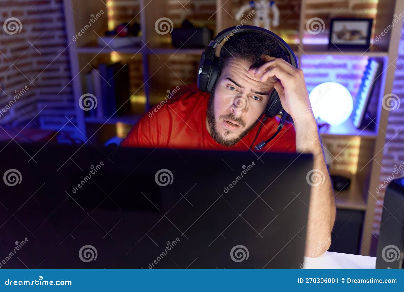 Young Hispanic Man Streamer Stressed Using Computer at Gaming Room ...