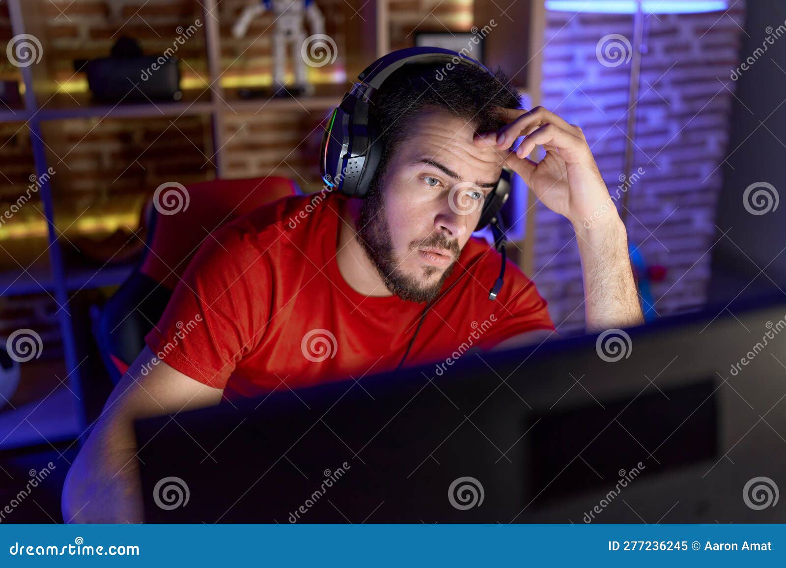 Young Hispanic Man Streamer Stressed Using Computer at Gaming Room ...
