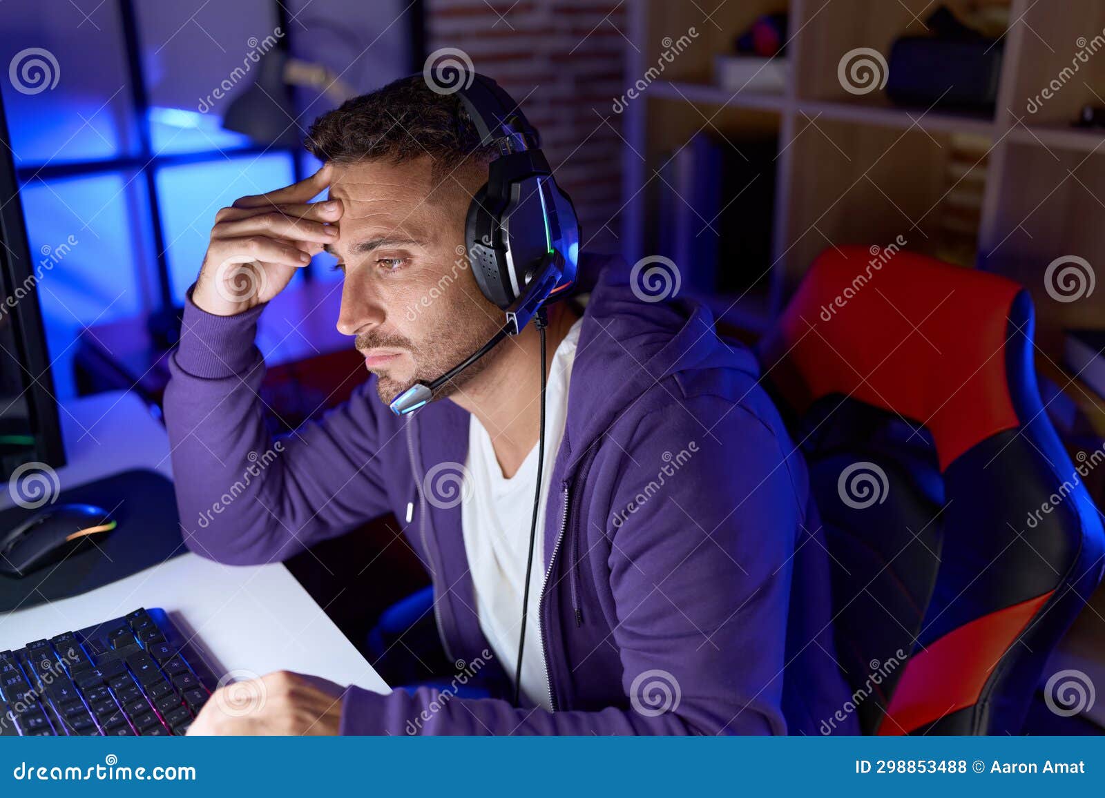 Young Hispanic Man Streamer Stressed Using Computer at Gaming Room ...