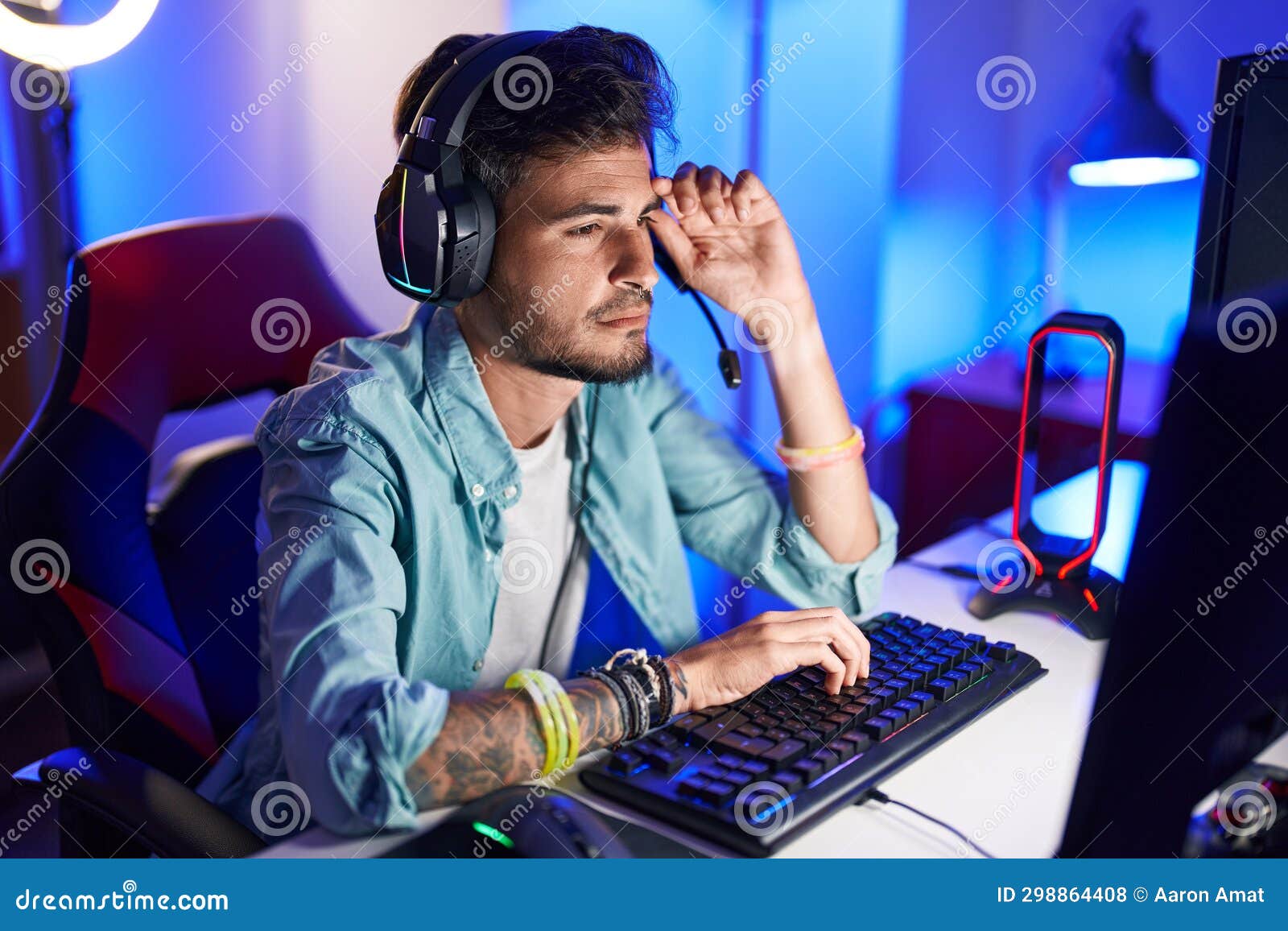 Young Hispanic Man Streamer Stressed Using Computer at Gaming Room ...