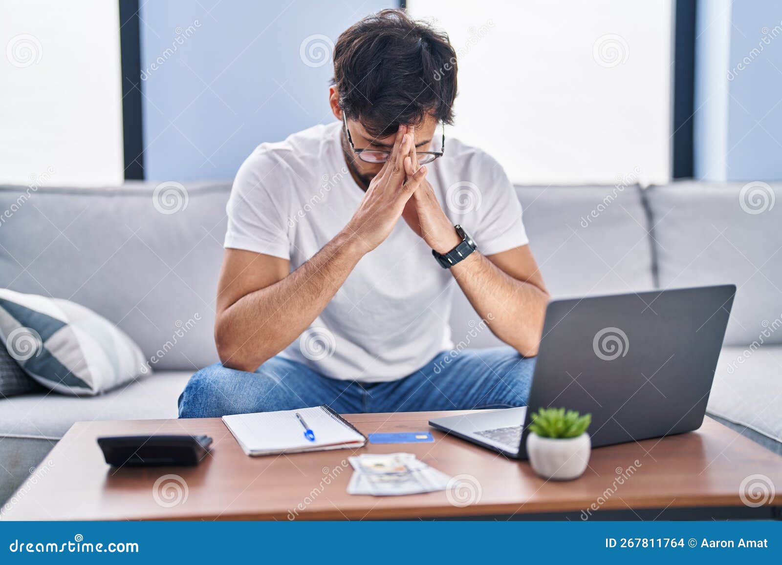 Young Hispanic Man Stressed Using Laptop Working at Home Stock Photo ...