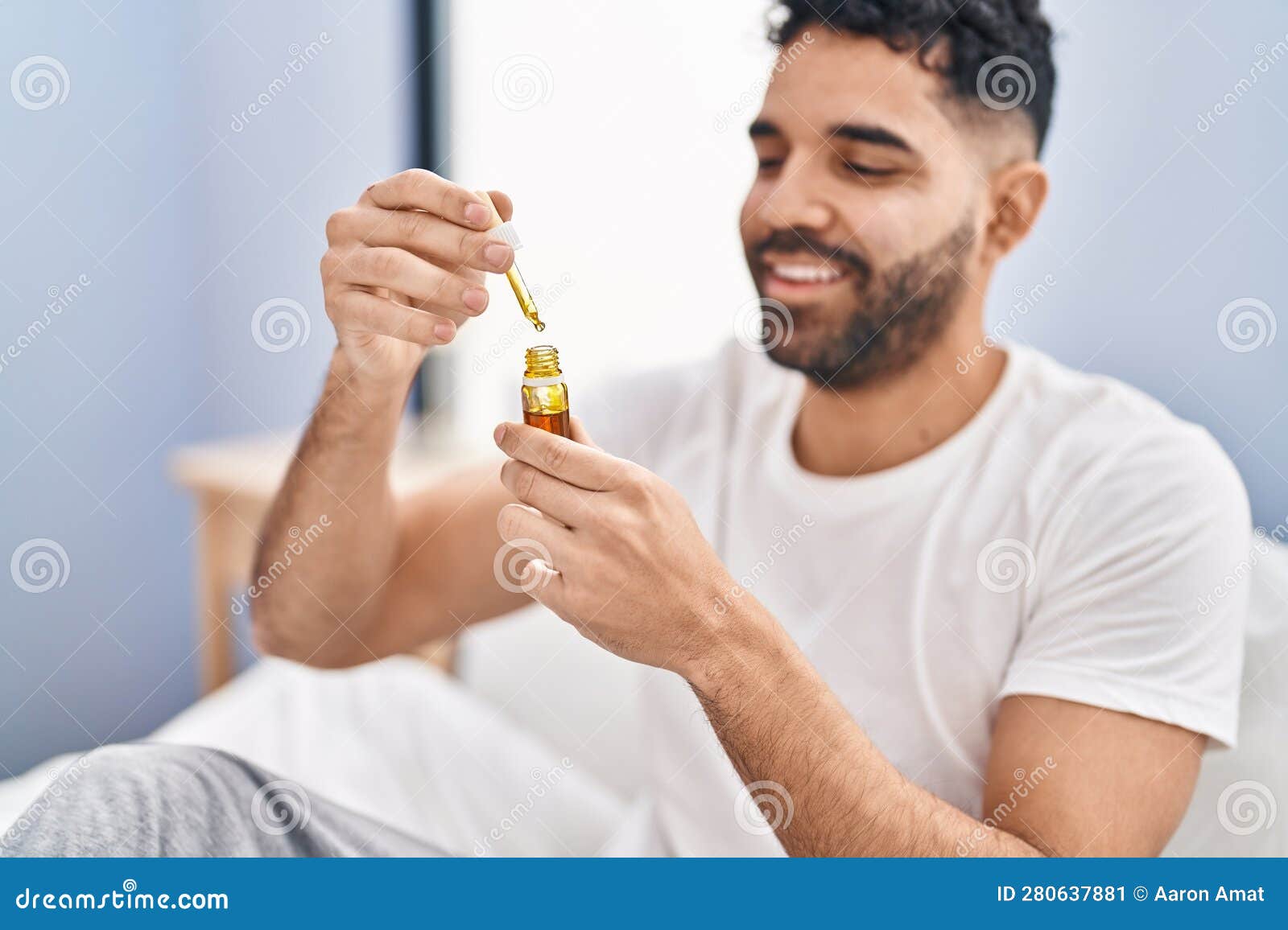 Young Hispanic Man Taking Syrup Sitting on Bed at Bedroom Stock Image ...