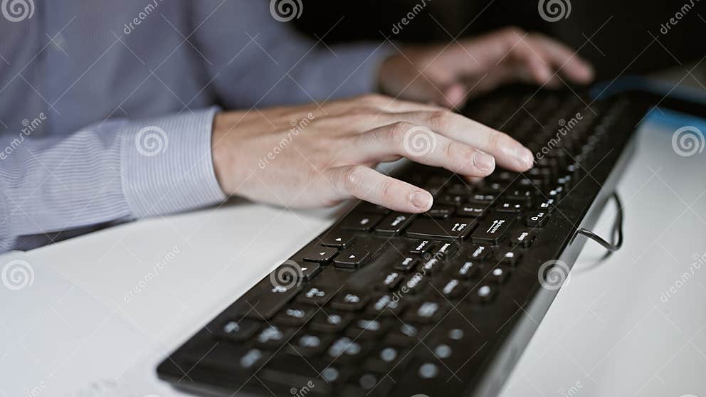 Young Hispanic Man Using Computer Typing on Keyboard at the Office ...