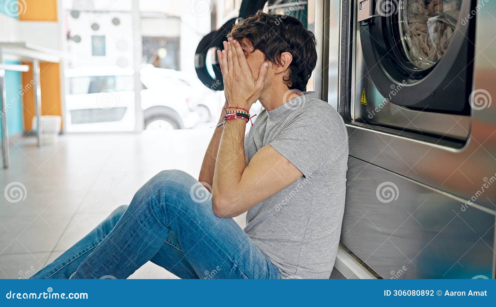 Young Hispanic Man Waiting for Washing Machine Stressed at Laundry ...