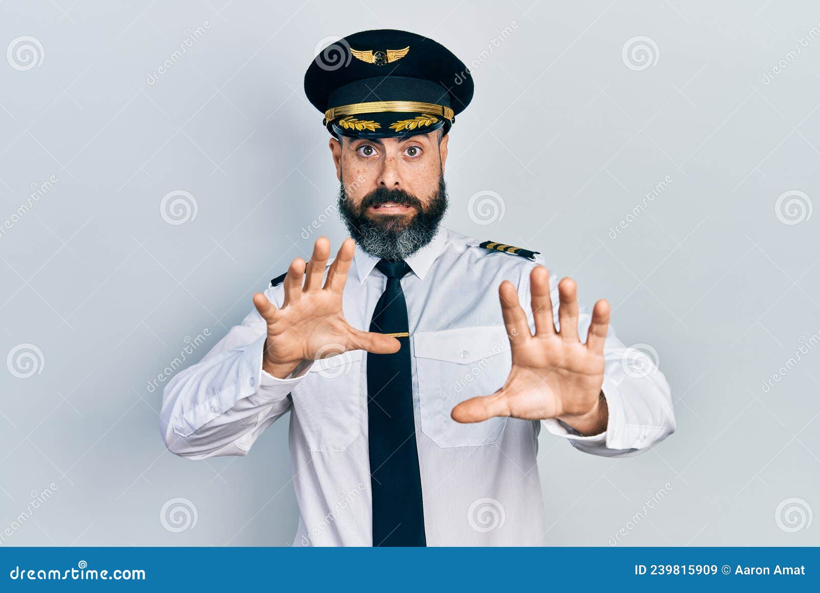 Young Hispanic Man Wearing Airplane Pilot Uniform Afraid and Terrified ...