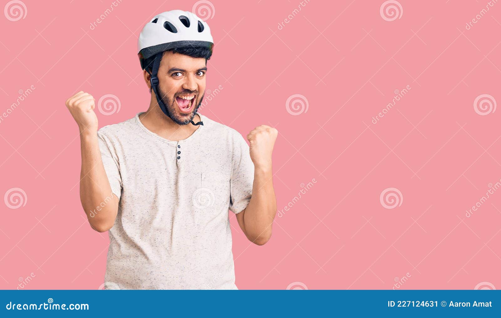 Young Hispanic Man Wearing Bike Helmet Screaming Proud Celebrating