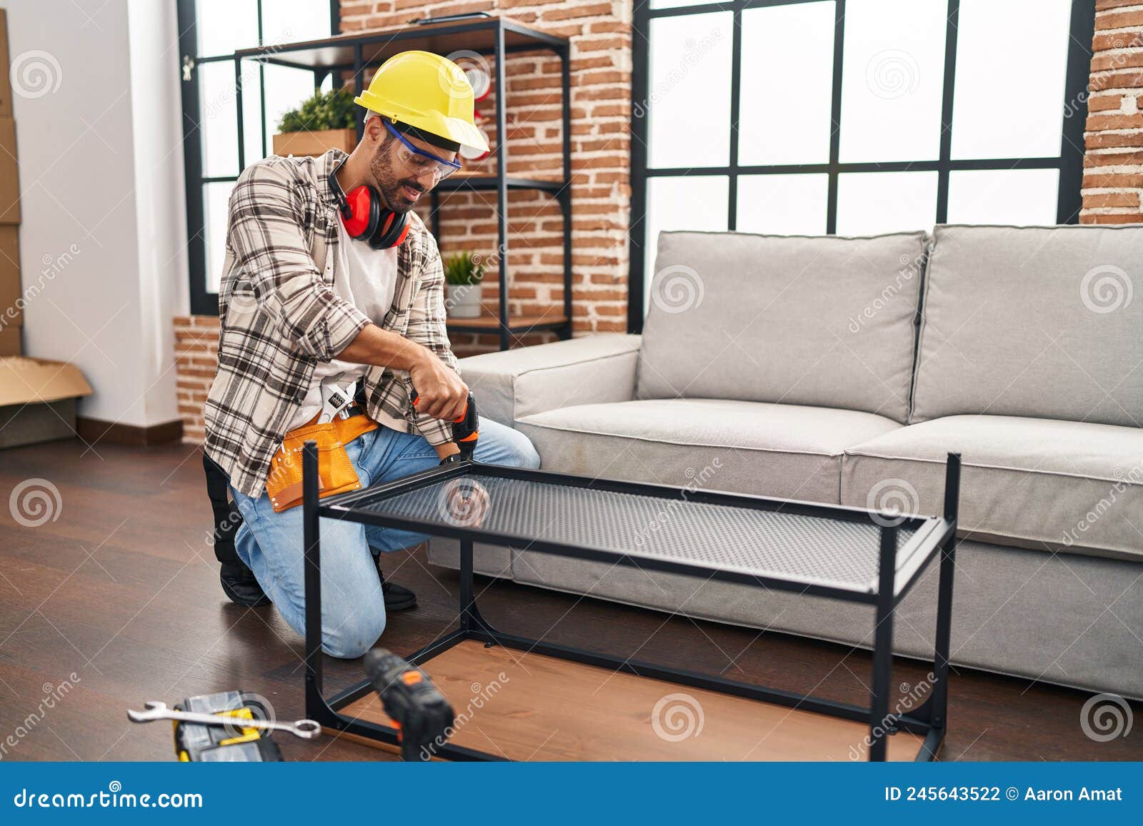 Young Hispanic Man Worker Smiling Confident Repairing Table at Home ...