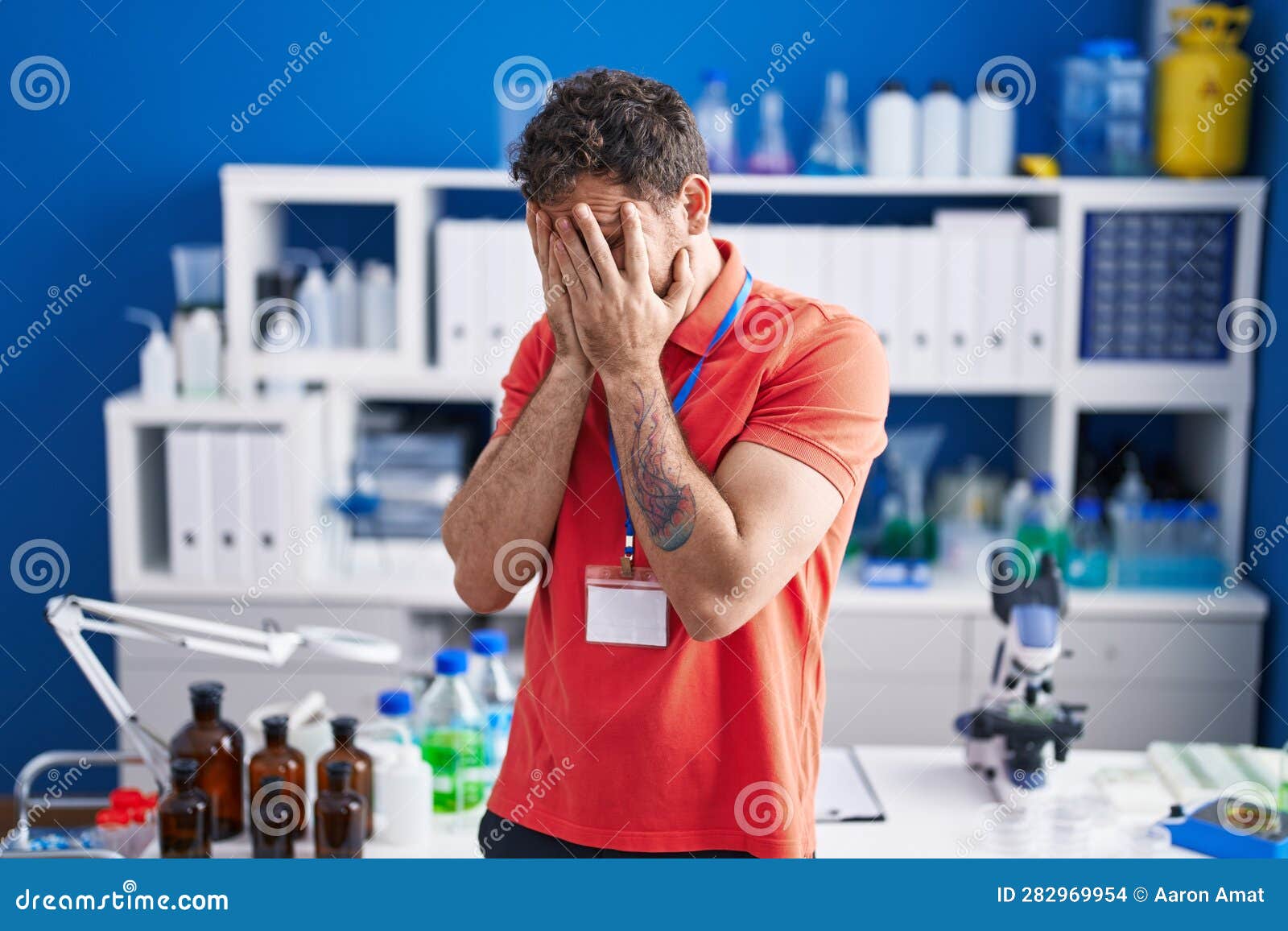 Young Hispanic Man Working at Scientist Laboratory with Sad Expression ...