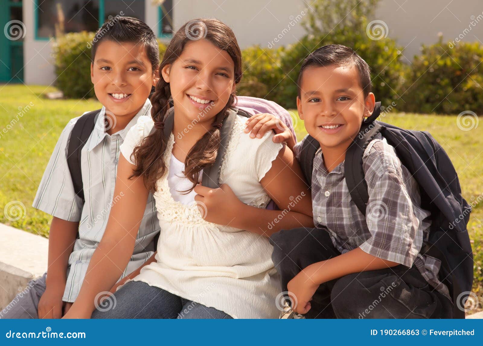 Young Hispanic Student Children Wearing Backpacks on School Campus ...