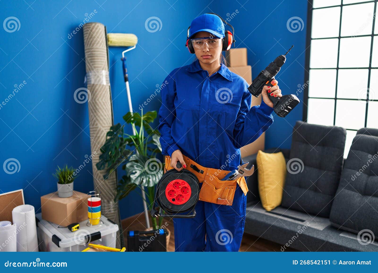 Young Hispanic Technician Working at Home Renovation Depressed and ...