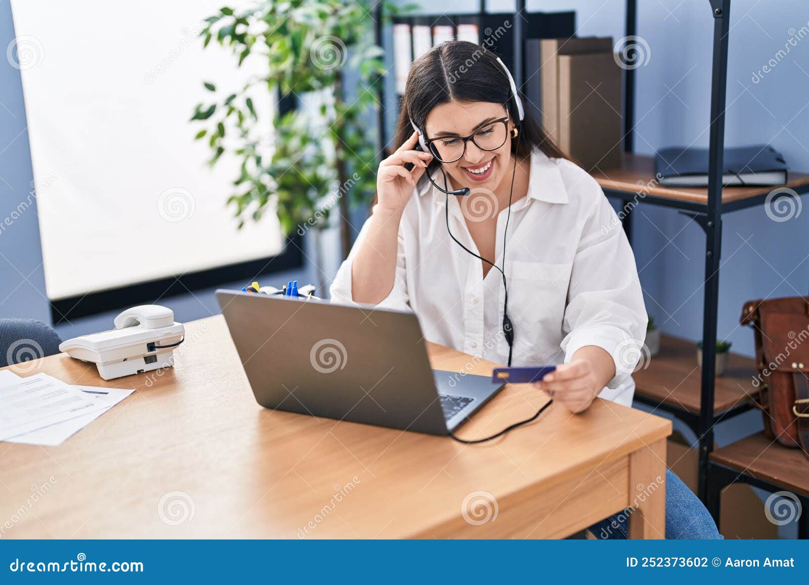 Young Hispanic Woman Call Center Agent Working at Office Stock Photo ...