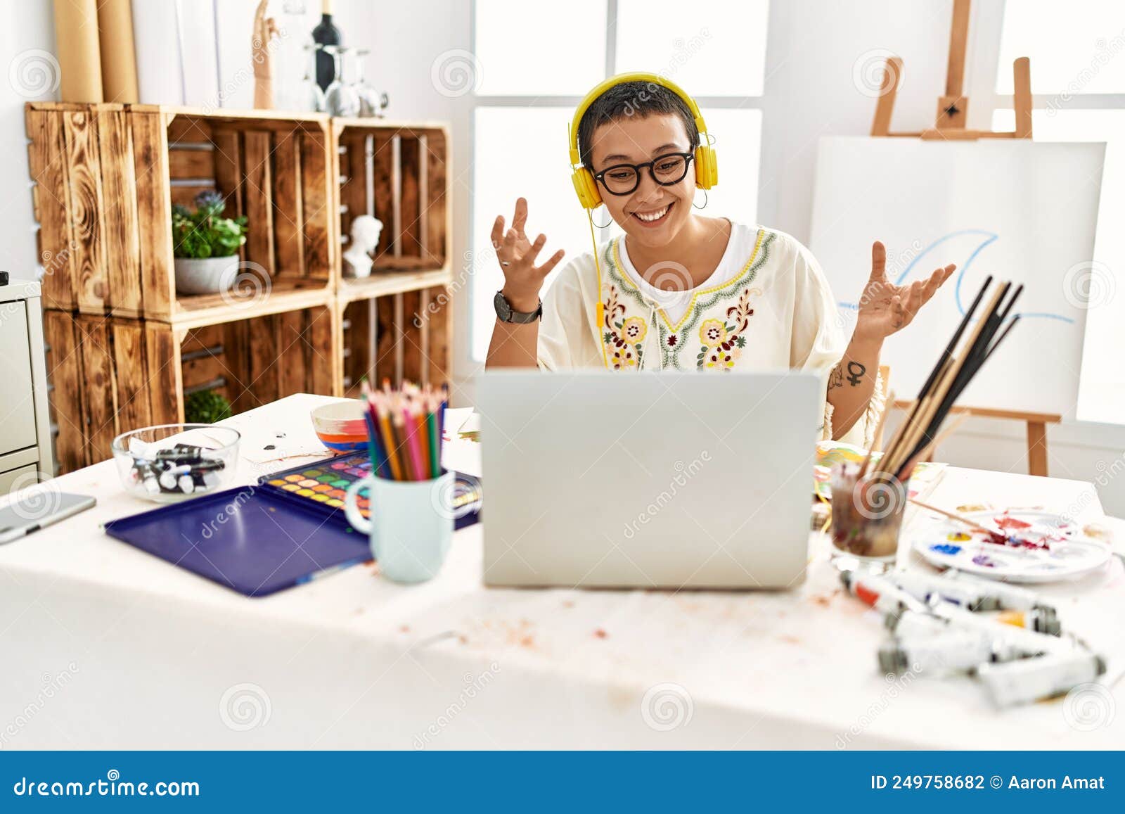Young Hispanic Woman Having Online Draw Lesson at Art Studio Stock ...