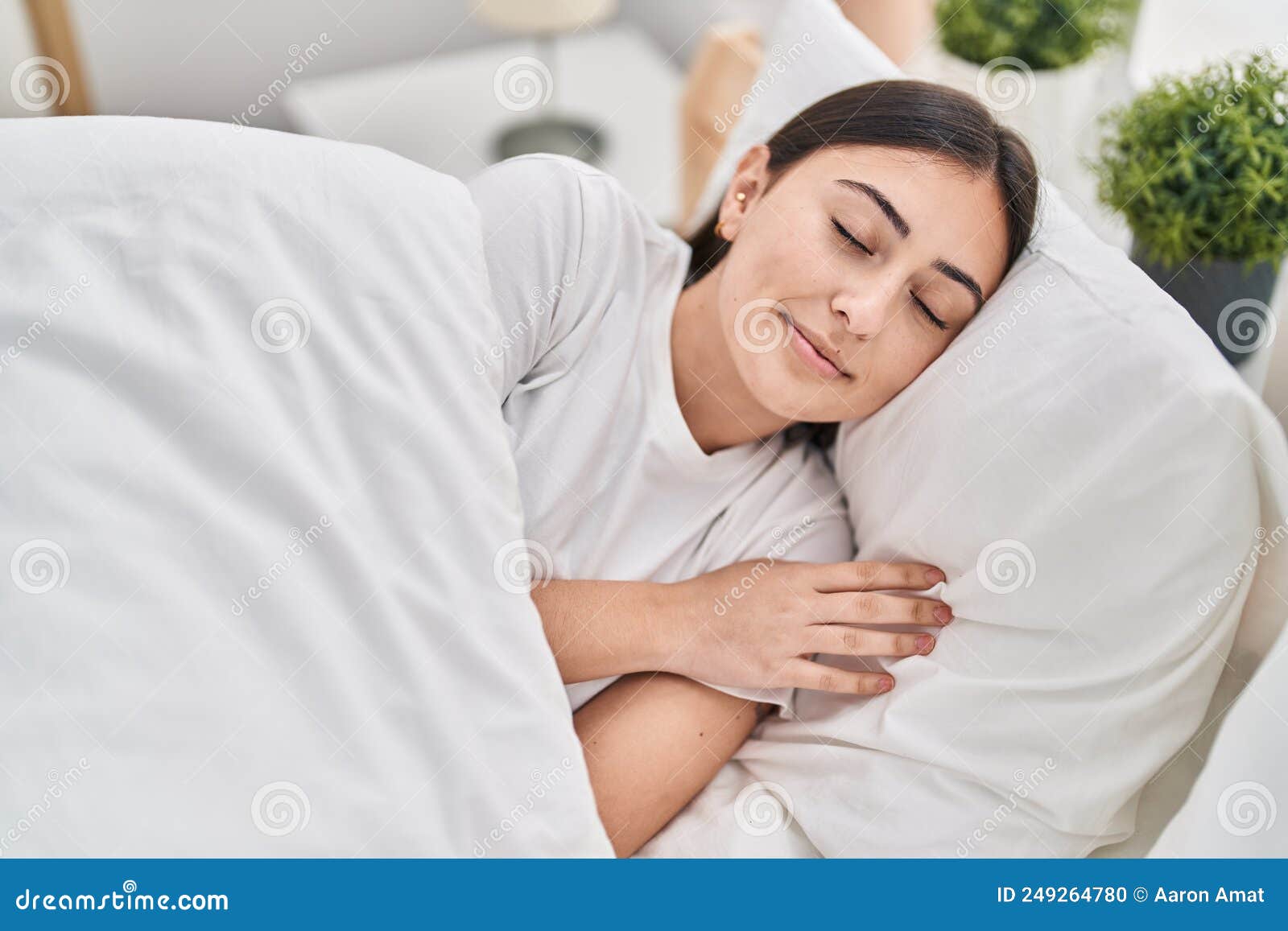 Young Hispanic Woman Lying on Bed Sleeping at Bedroom Stock Photo ...