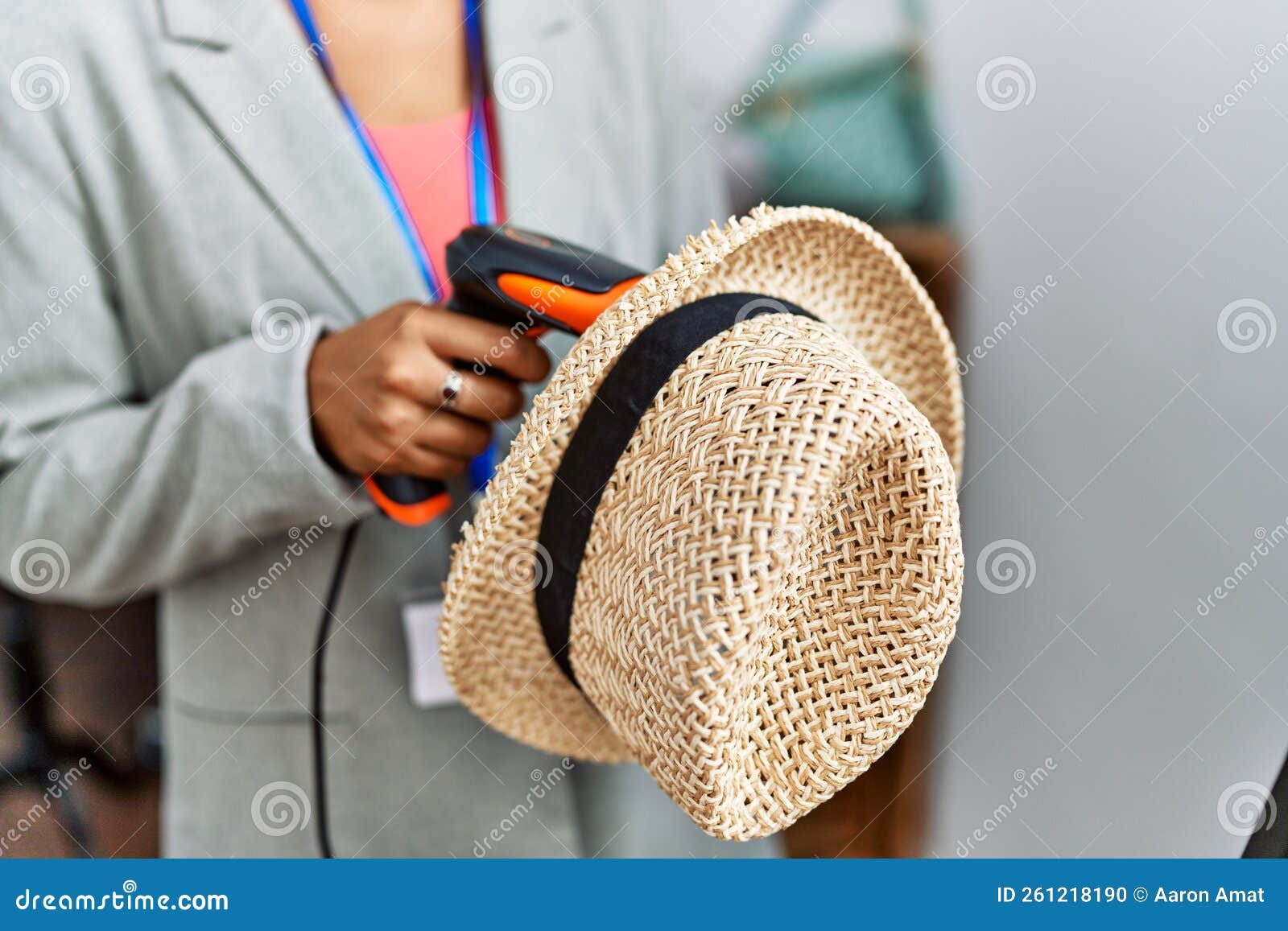Young Hispanic Woman Shopkeeper Scanning Hat Using Bardcode Reader at ...