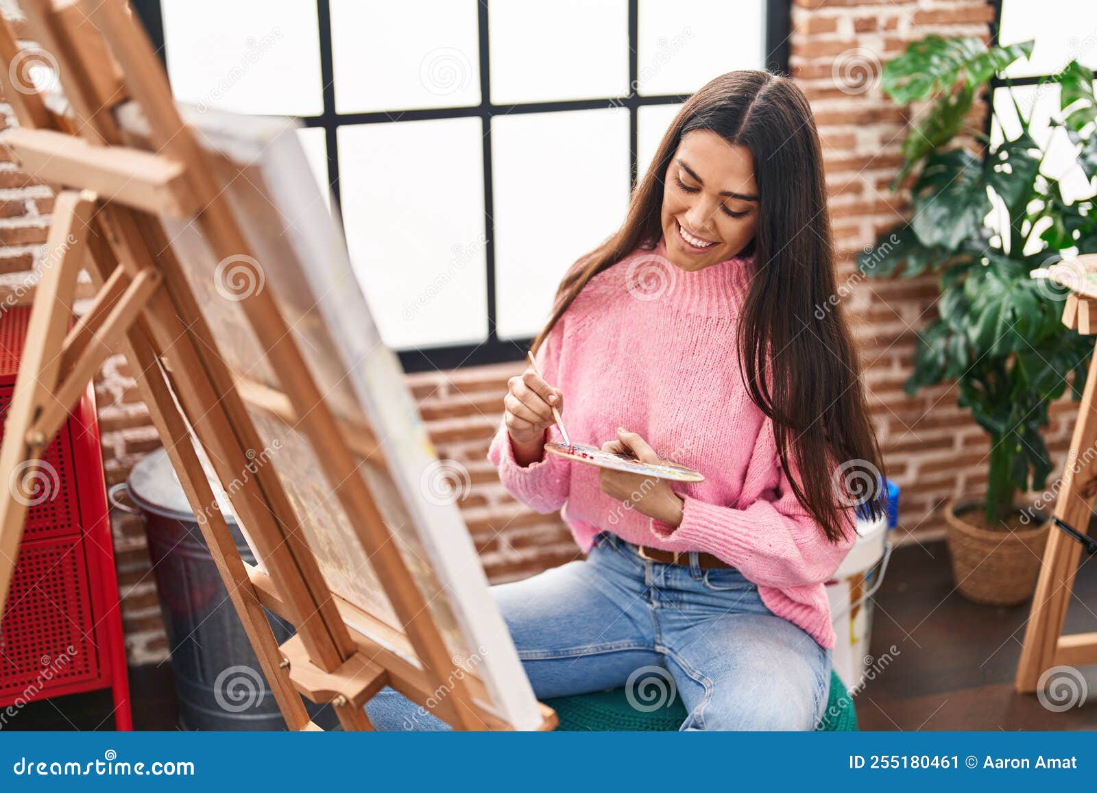 Young Hispanic Woman Smiling Confident Drawing at Art Studio Stock ...