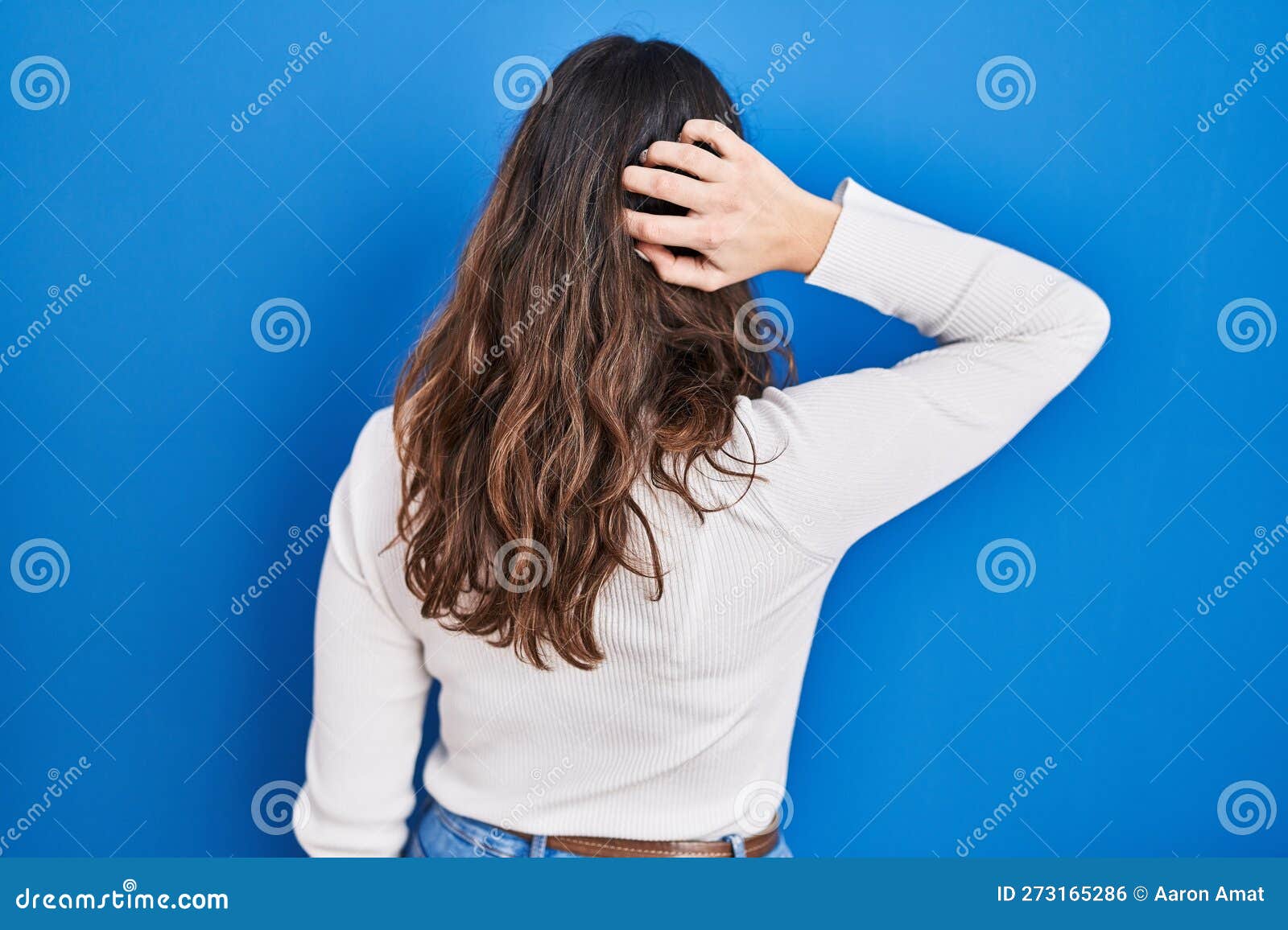 Young Hispanic Woman Standing Over Blue Background Backwards Thinking ...