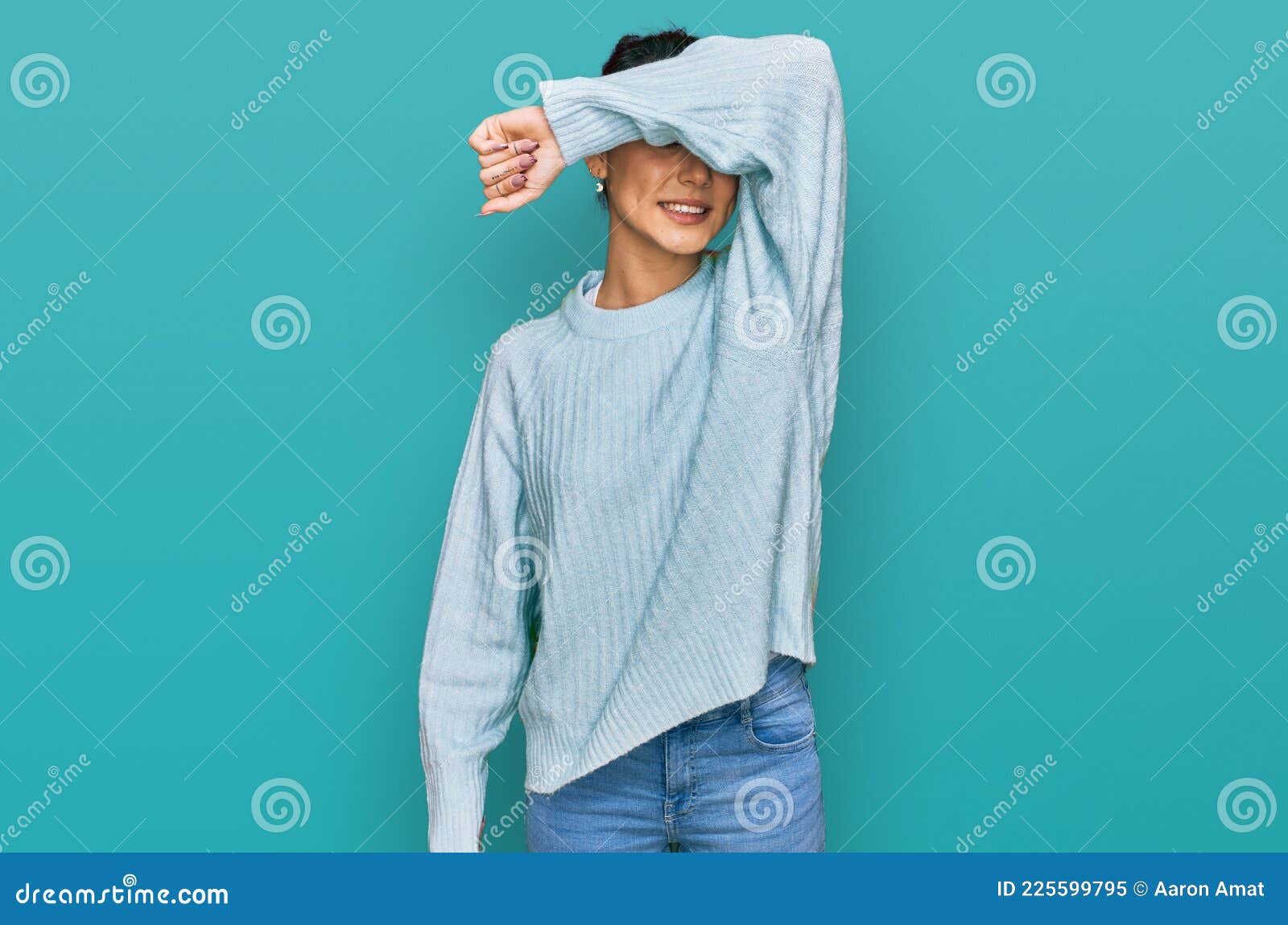 Young Hispanic Woman Wearing Casual Clothes Covering Eyes With Arm