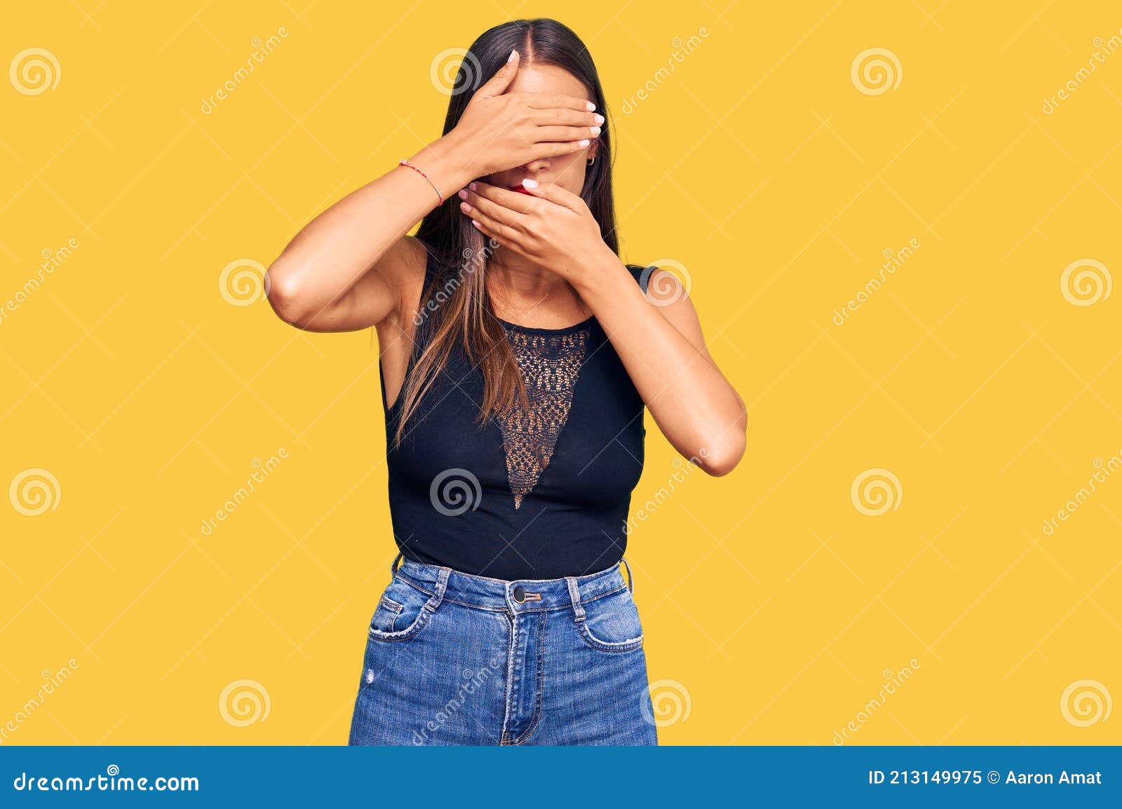 Young Hispanic Woman Wearing Casual Clothes Covering Eyes And Mouth