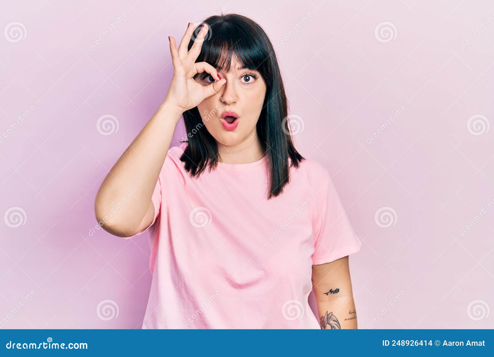 Young Hispanic Woman Wearing Casual Clothes Doing Ok Gesture Shocked