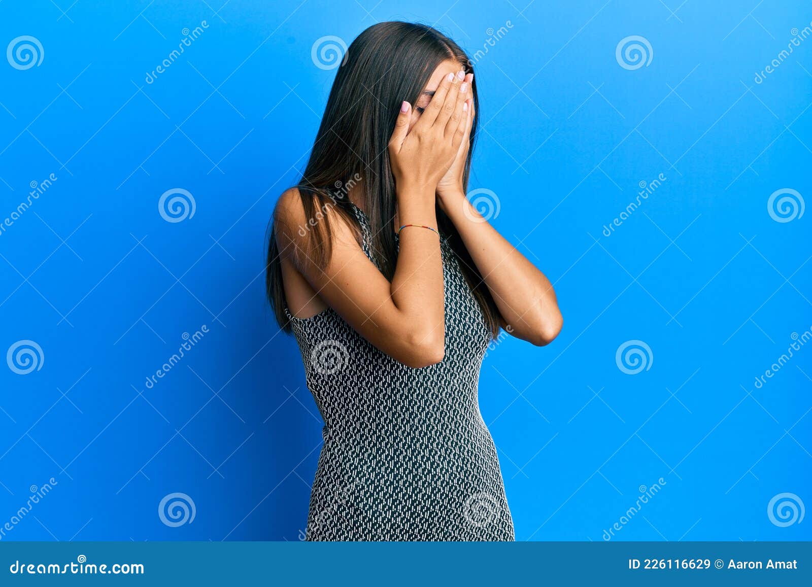 Young Hispanic Woman Wearing Casual Clothes With Sad Expression