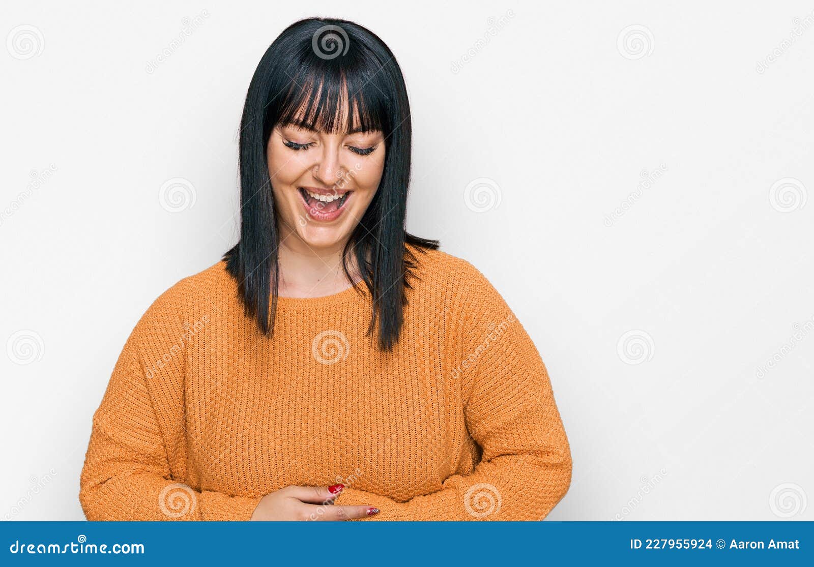 Young Hispanic Woman Wearing Casual Clothes Smiling And Laughing Hard