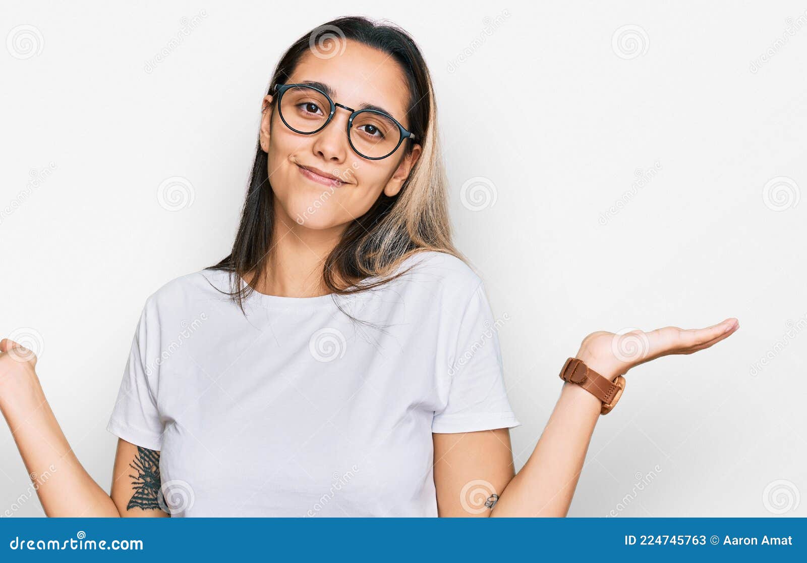 Young Hispanic Woman Wearing Casual White T Shirt Clueless And Confused