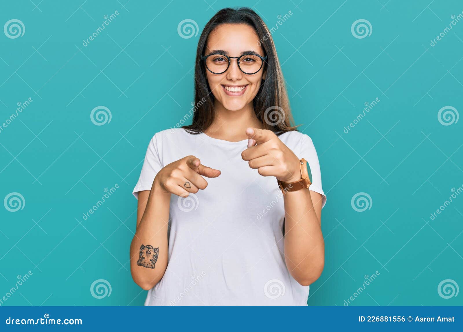 Young Hispanic Woman Wearing Casual White T Shirt Pointing Fingers To