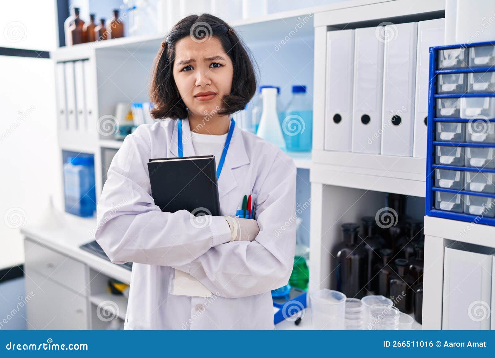 Young Hispanic Woman Working at Scientist Laboratory Clueless and ...