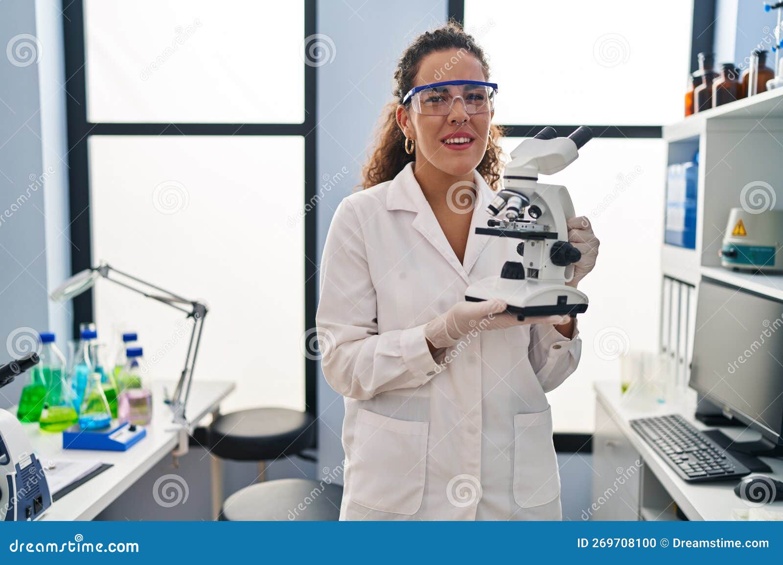 Young Hispanic Woman Working at Scientist Laboratory Clueless and ...