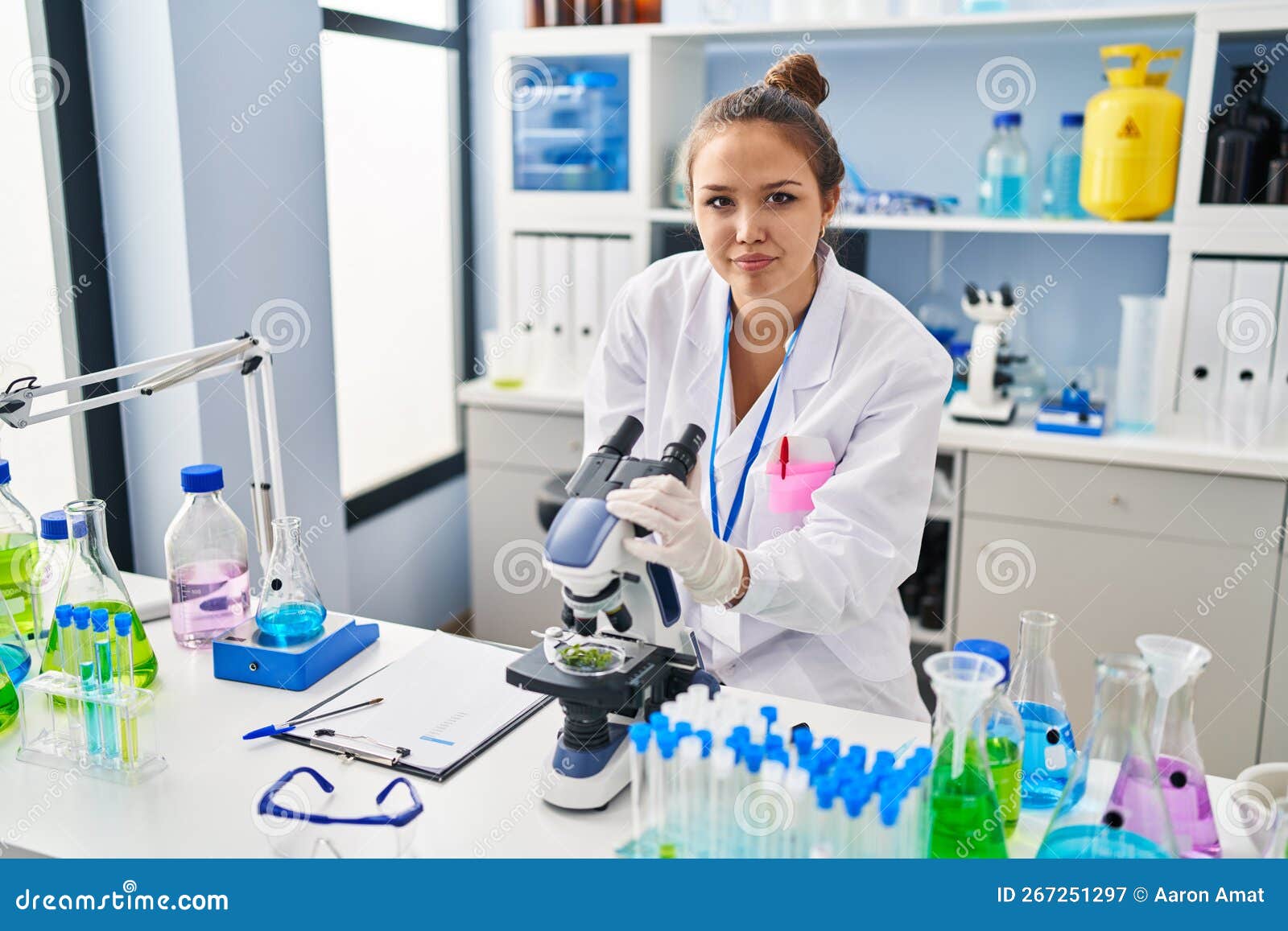Young Hispanic Woman Working at Scientist Laboratory Thinking Attitude ...