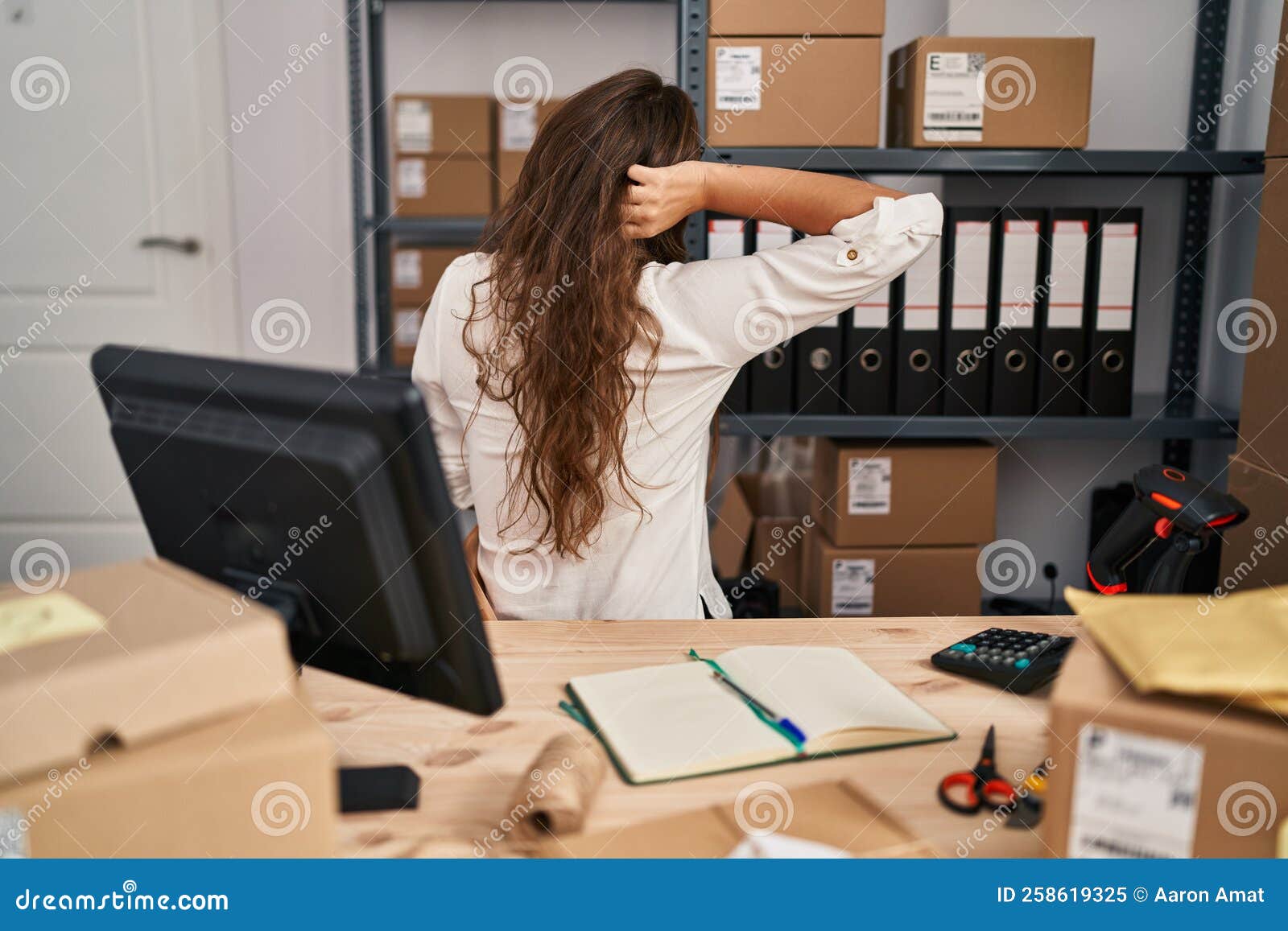Young Hispanic Woman Working at Small Business Ecommerce Backwards ...