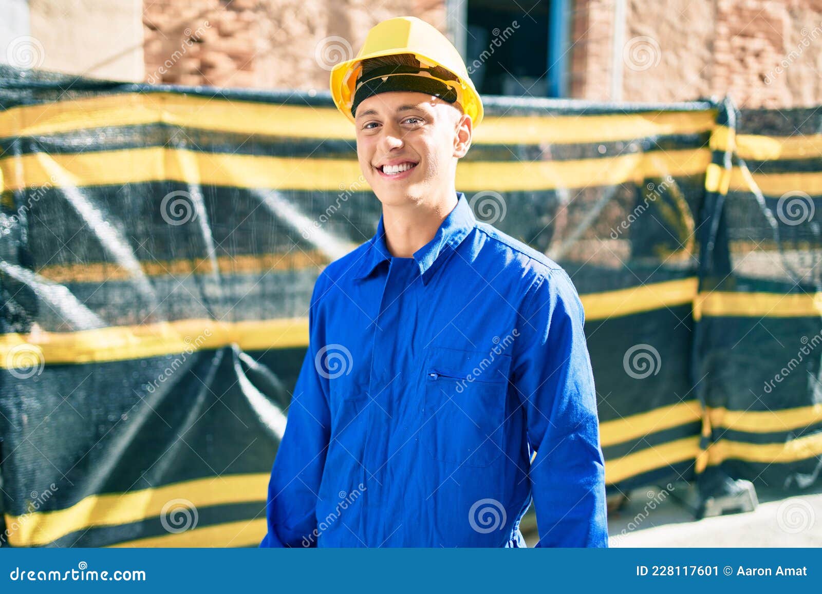 Young Hispanic Workman Smiling Happy Working at Street of City Stock ...