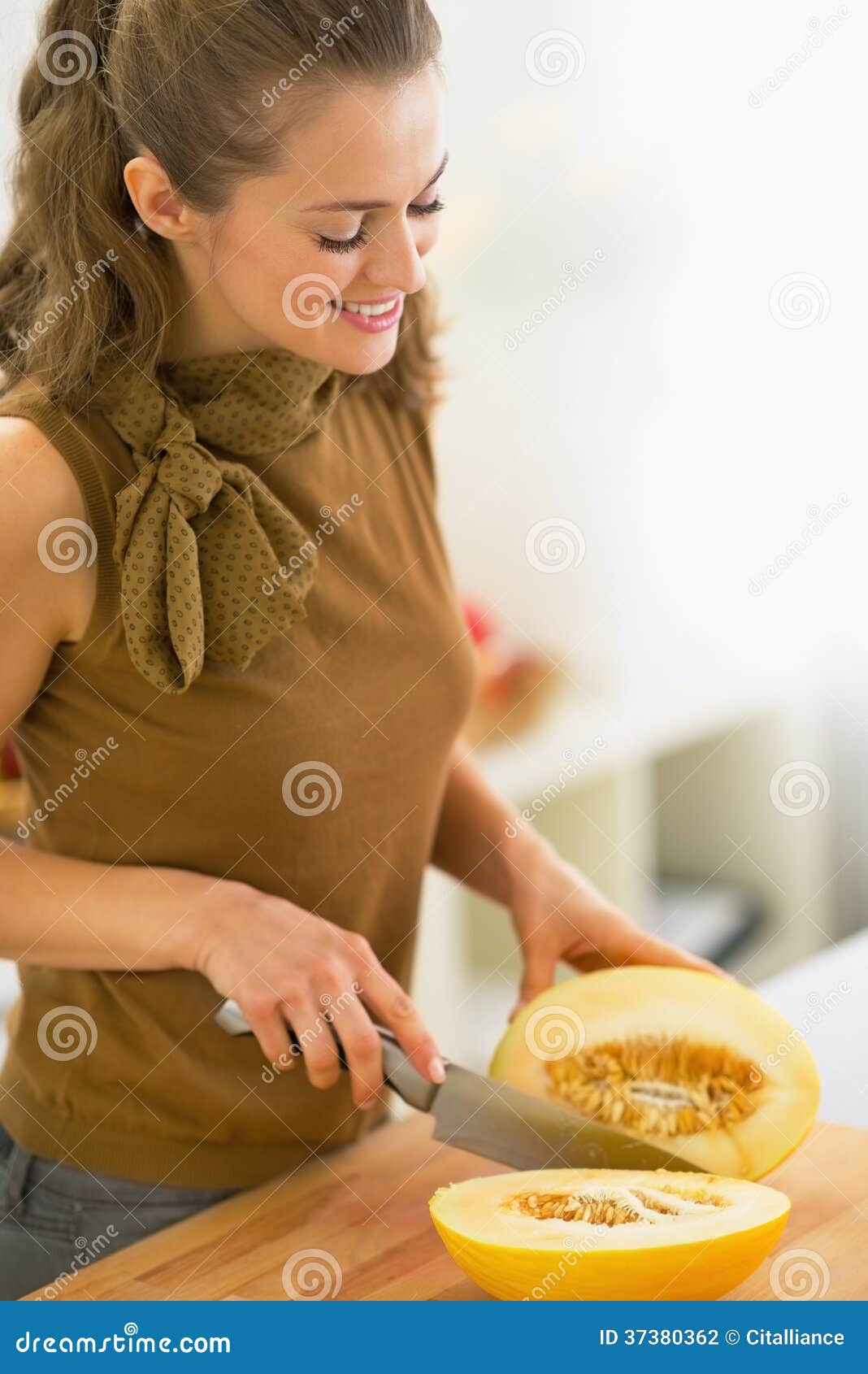 Young Housewife Cutting Melon in Kitchen Stock Photo - Image of fresh ...