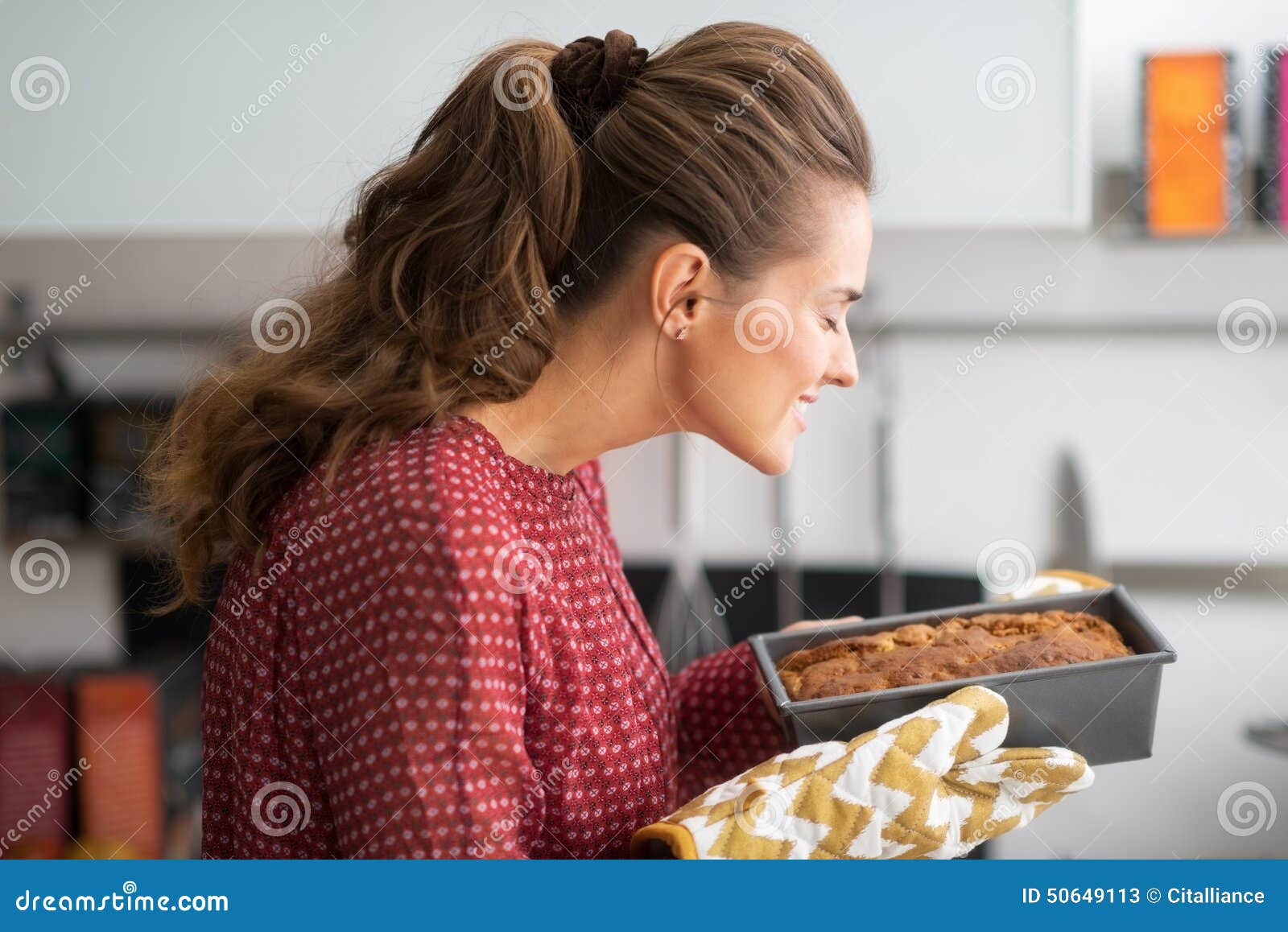 Young Housewife Smelling Baking Dish with Bread Stock Image - Image of ...