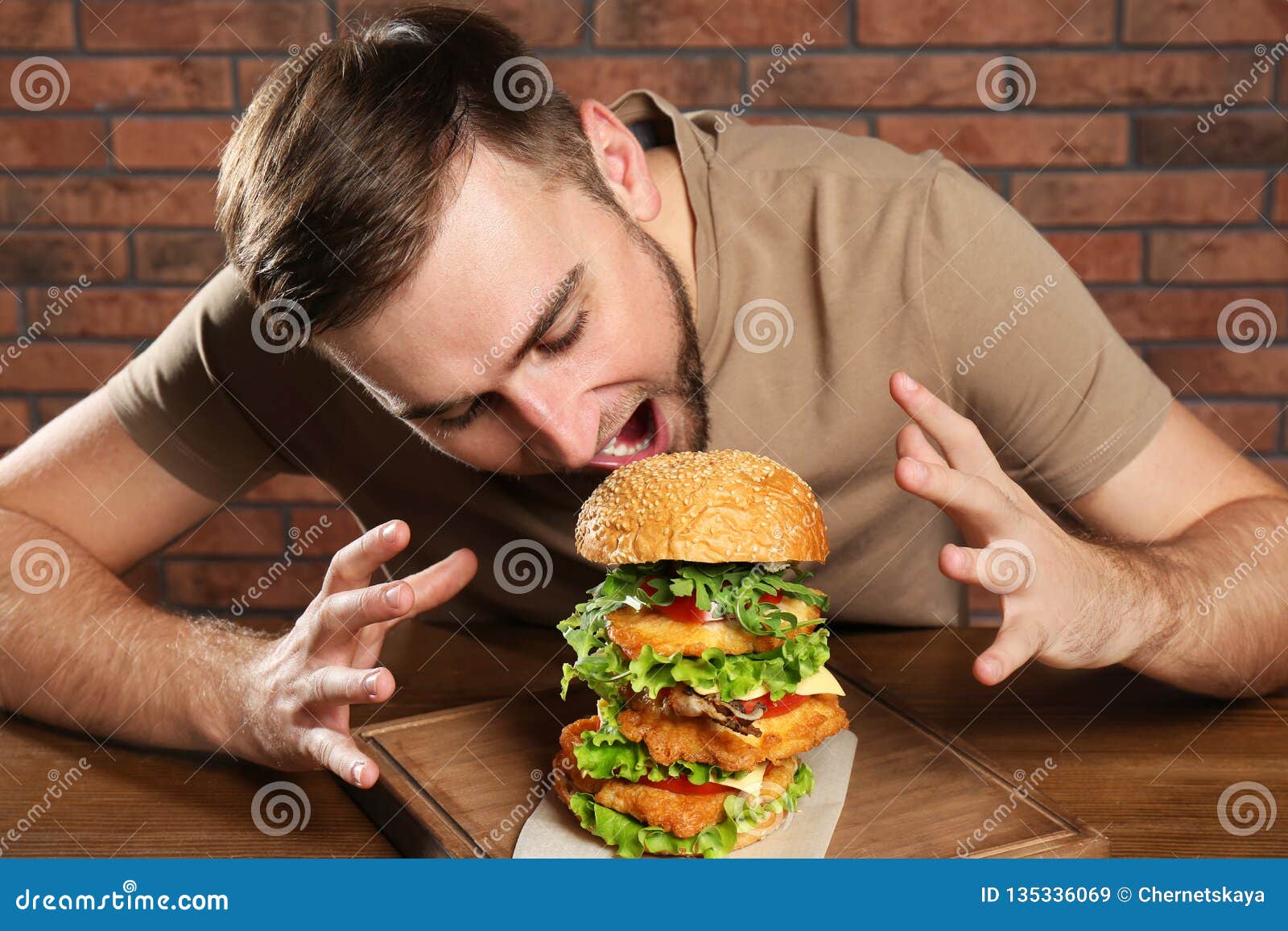 Young Hungry Man Eating Huge Burger Stock Image - Image of lettuce ...